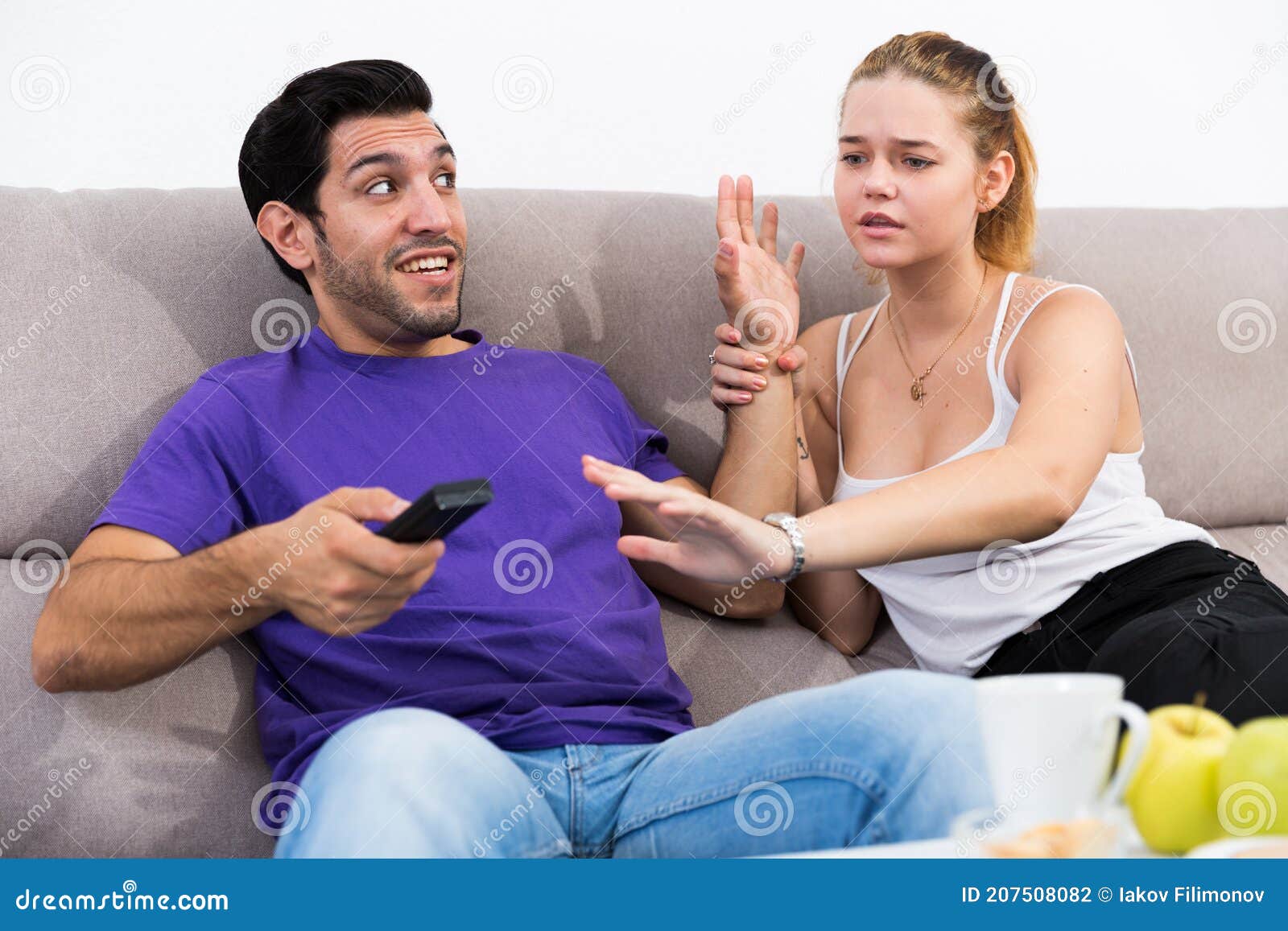 Couple Arguing because of TV Remote Stock Photo - Image of dispute ...
