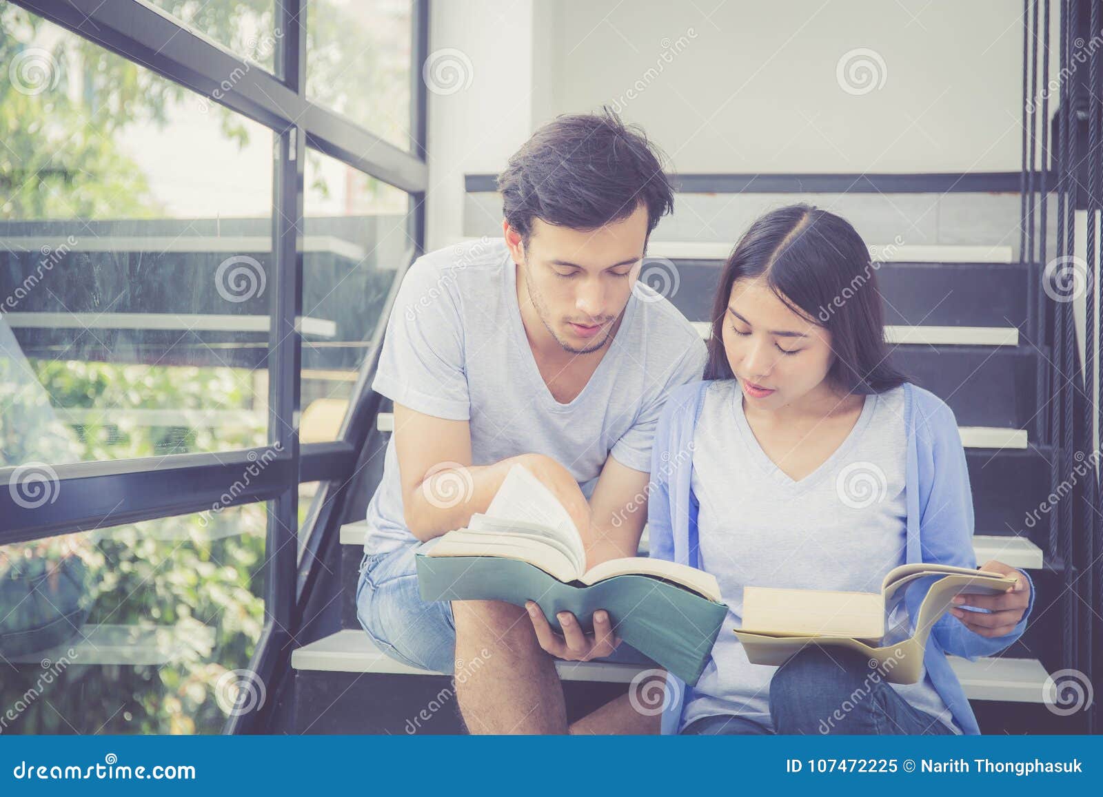 Couple Asian Handsome Man And Beautiful Woman Reading Book And Smile
