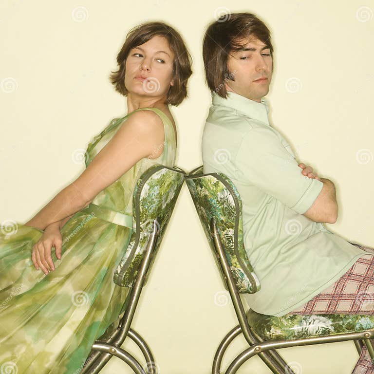 Couple back to back. stock image. Image of caucasian, modern - 2425511