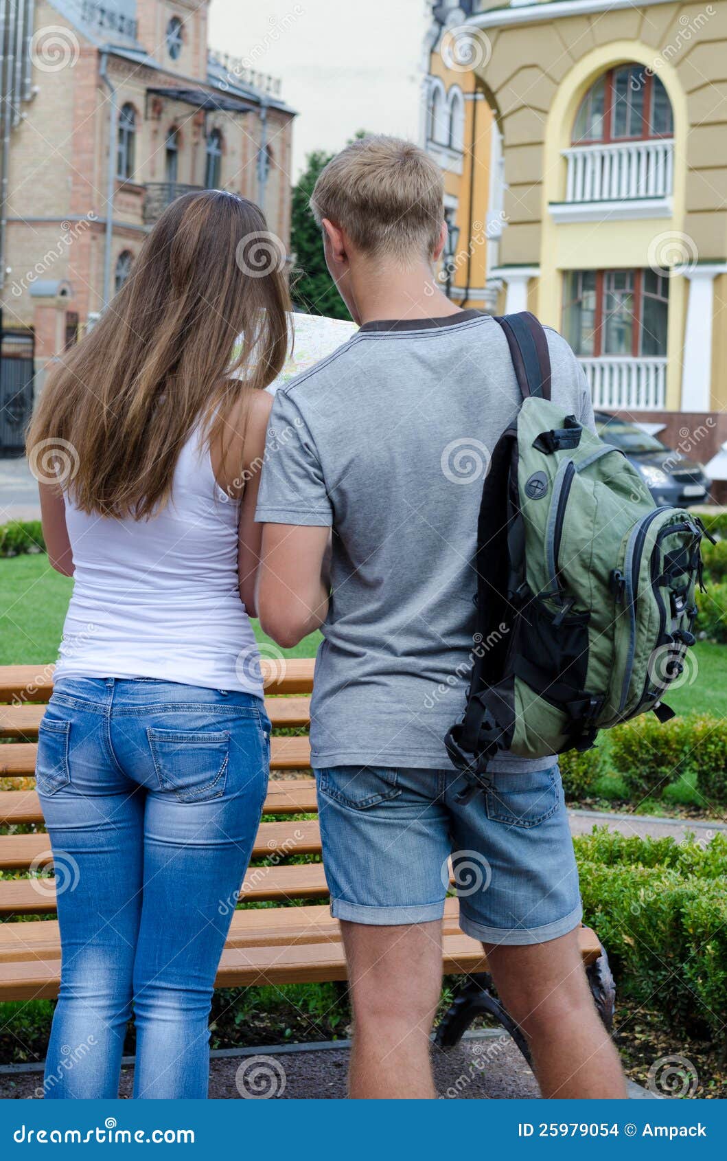 Couple with Backpack Looking at Map Stock Photo - Image of bearings ...