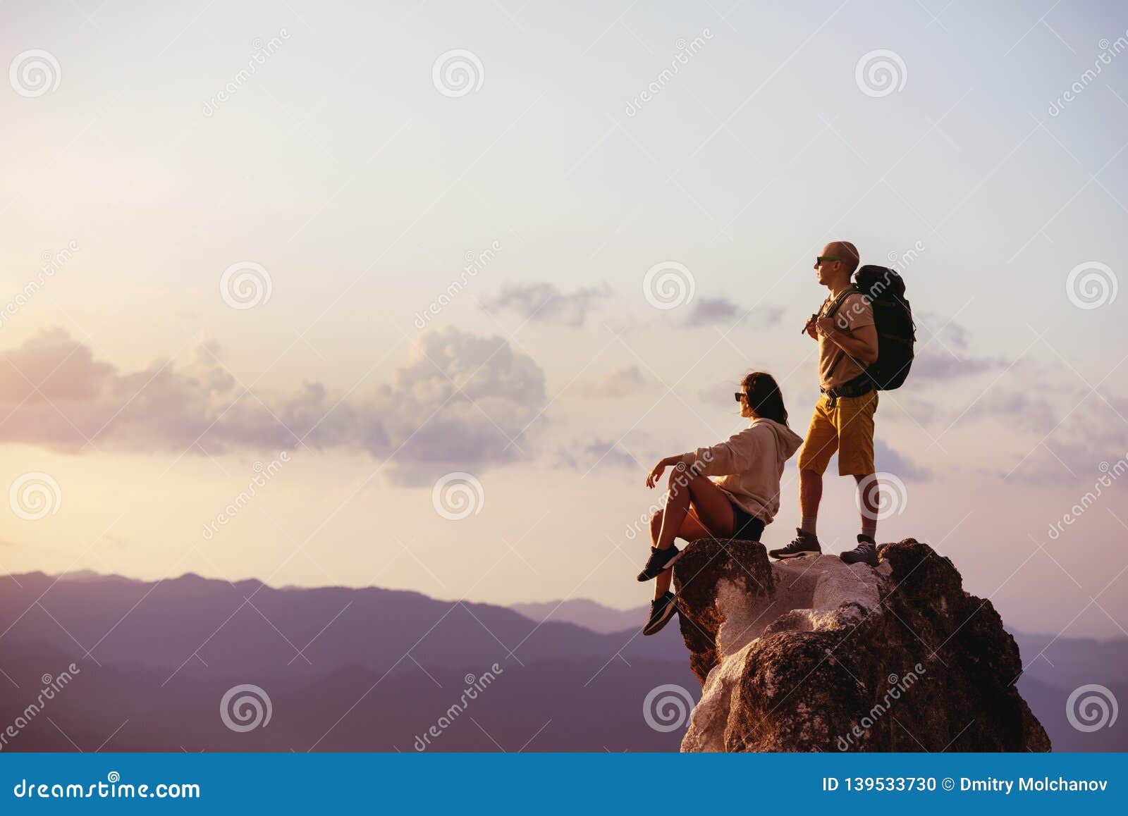 Couple Backpackers on Big Rock at Sunset Stock Photo - Image of hike ...