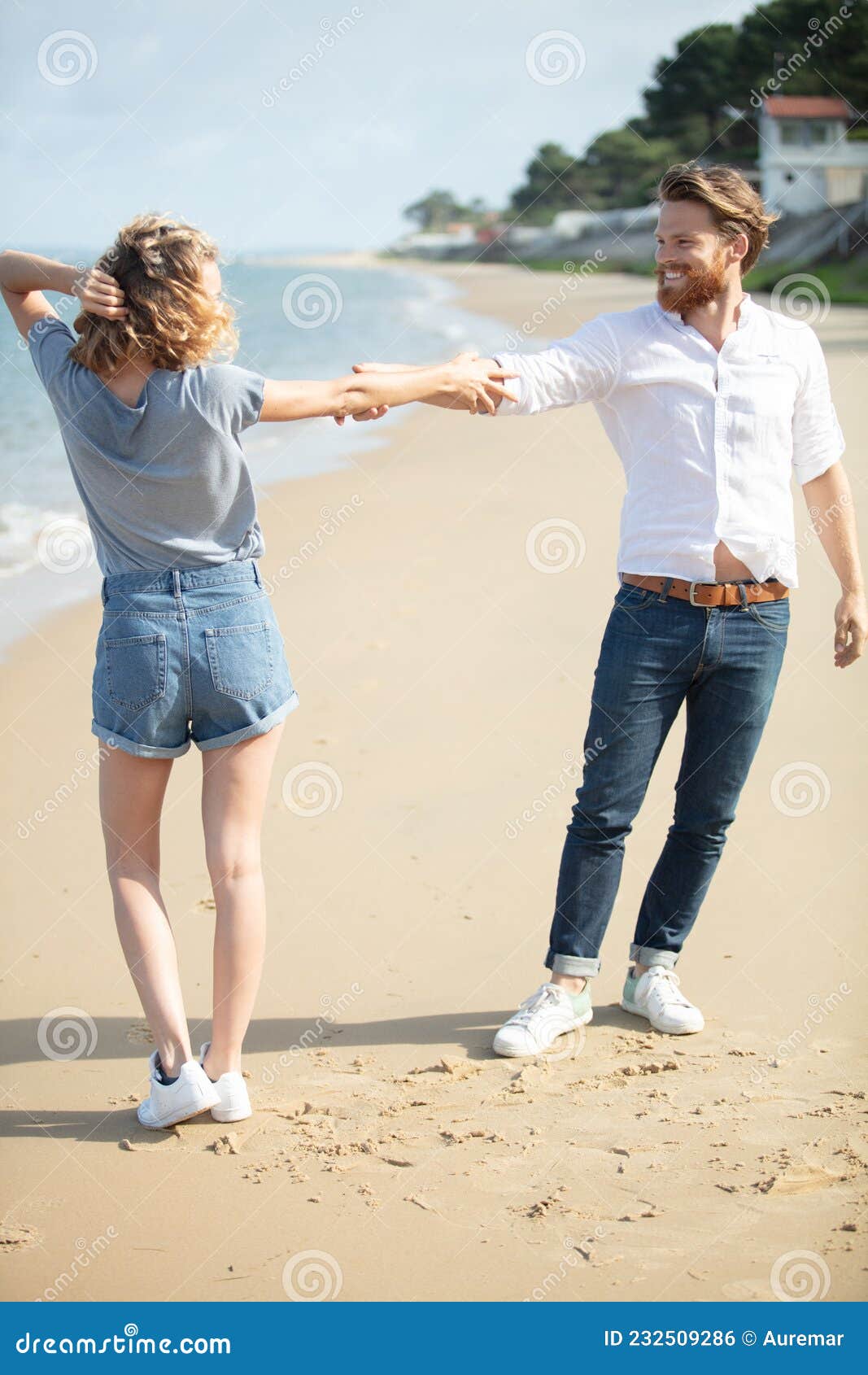 Couple on Beach with Interlinked Arms Stock Photo - Image of vacation ...