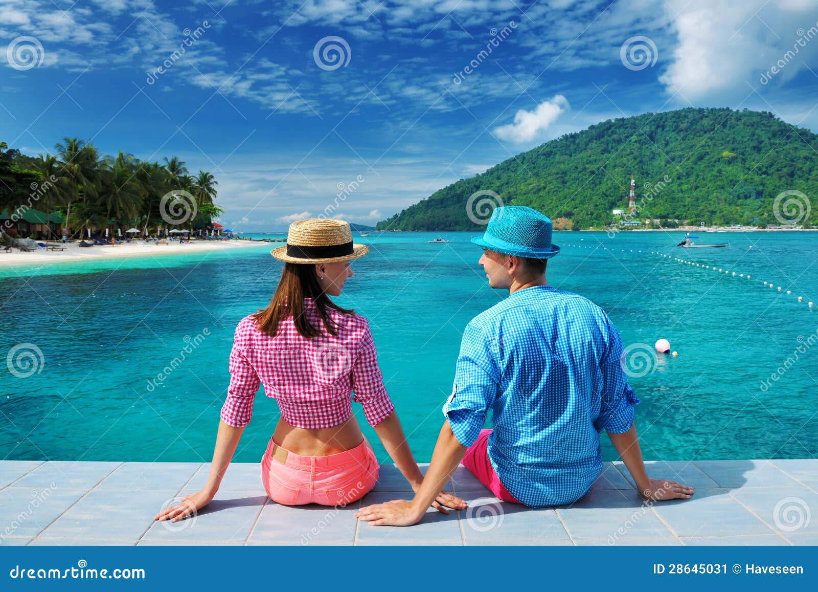 Couple at beach jetty stock image. Image of island, summer - 28645031