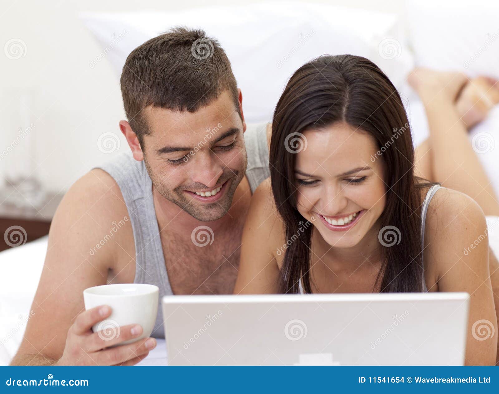 Couple in Bed Having Fun with a Laptop Stock Photo - Image of computer ...
