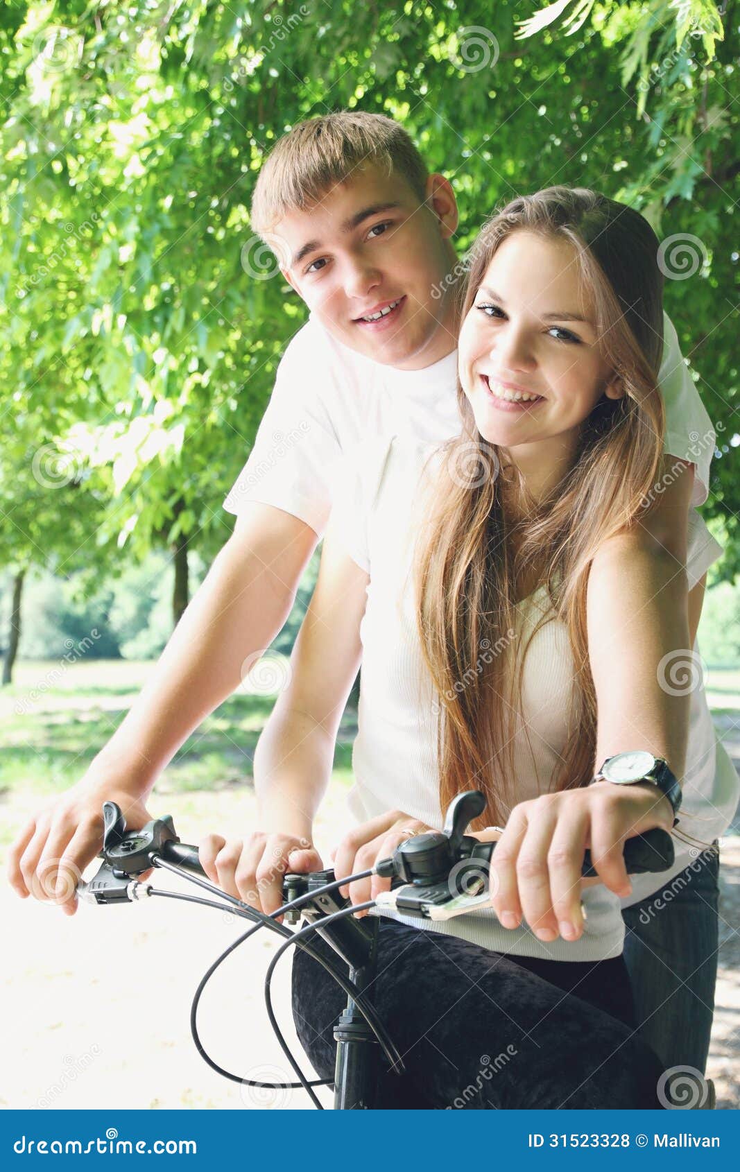 Couple on a bicycle stock photo. Image of beauty, cycling - 31523328