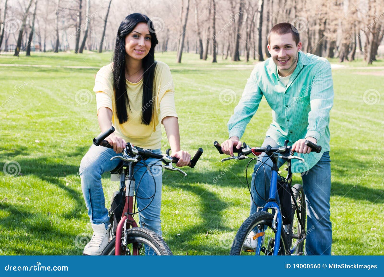 Couple on bike stock photo. Image of casually, active - 19000560