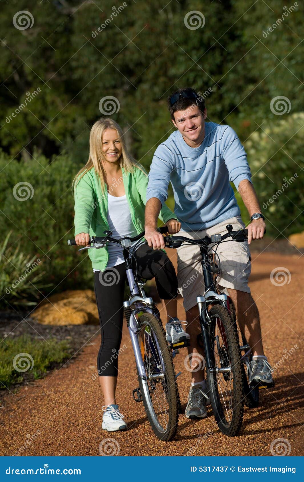 Couple on Bikes stock image. Image of slim, looking, young - 5317437