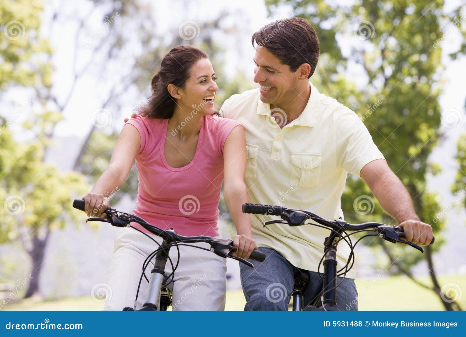 Couple on Bikes Outdoors Smiling Stock Photo - Image of latin, length ...