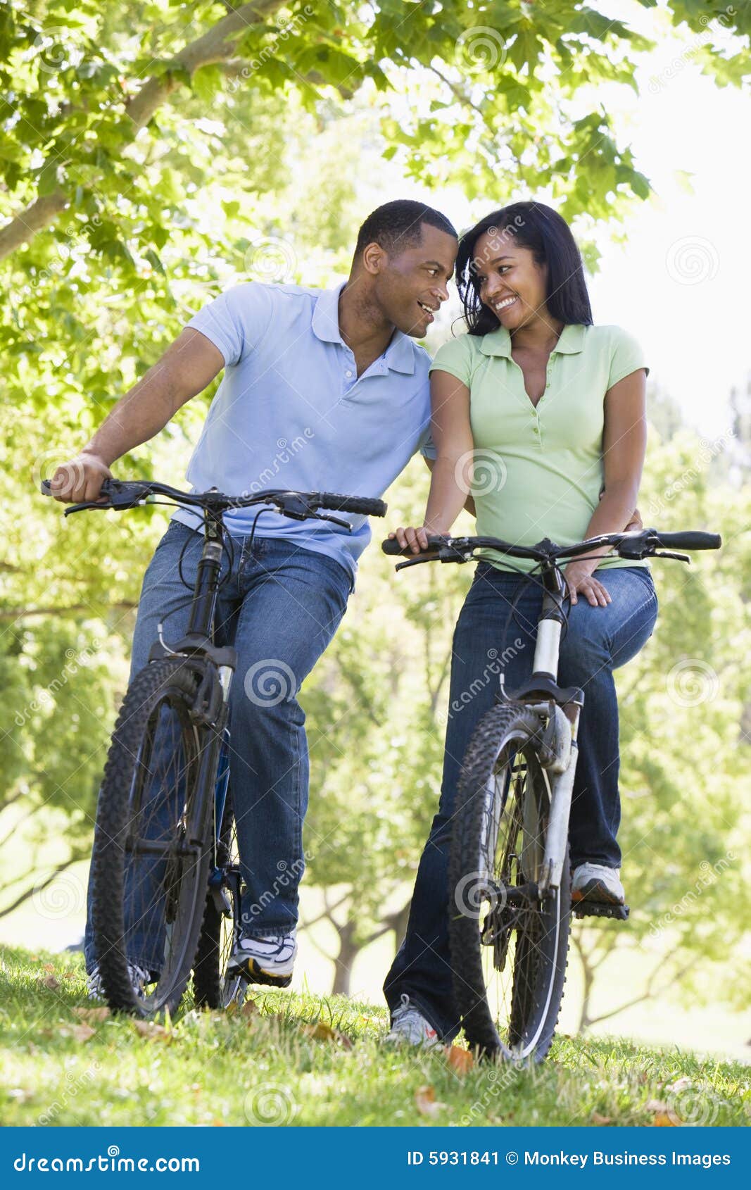 Couple on Bikes Outdoors Smiling Stock Image - Image of female ...