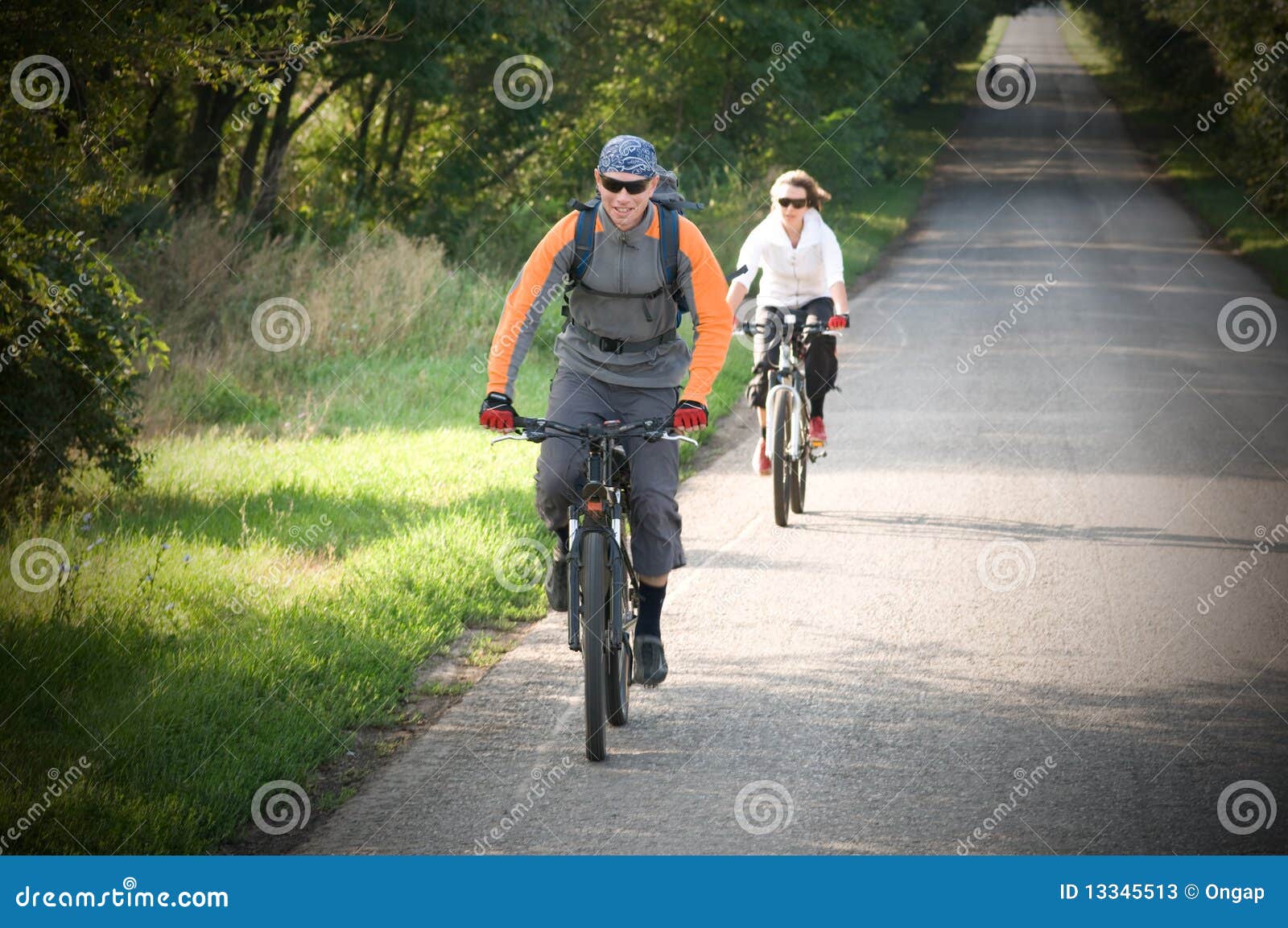 Couple biking stock image. Image of bike, people, cycling - 13345513