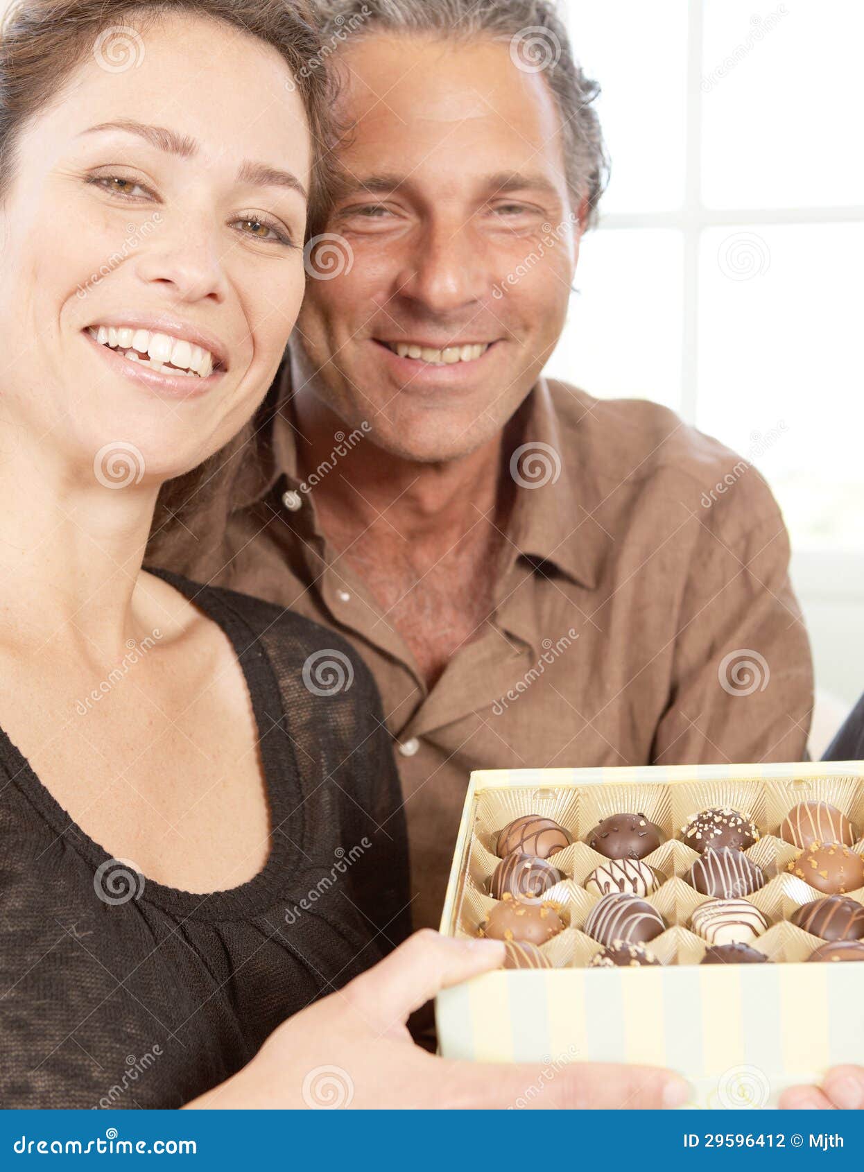 Couple with Box of Chocolates. Stock Photo - Image of gestures, happy ...