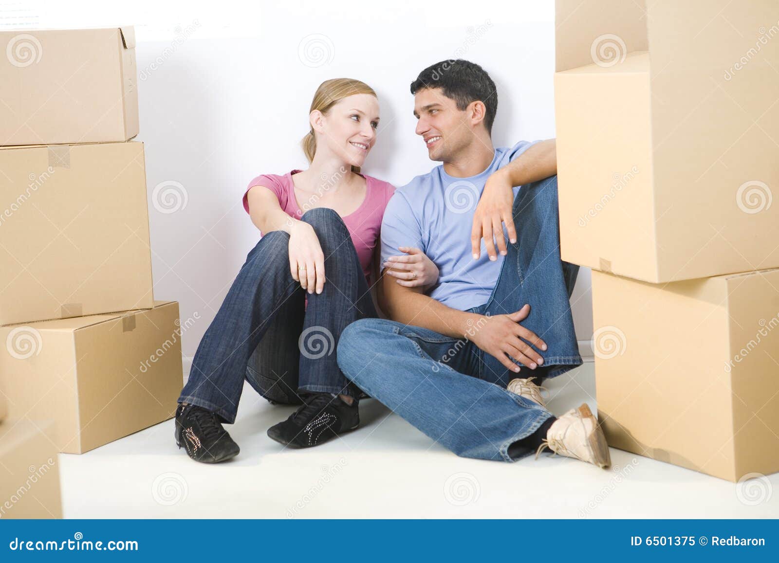 Couple between boxes stock image. Image of domestic, homeowner - 6501375
