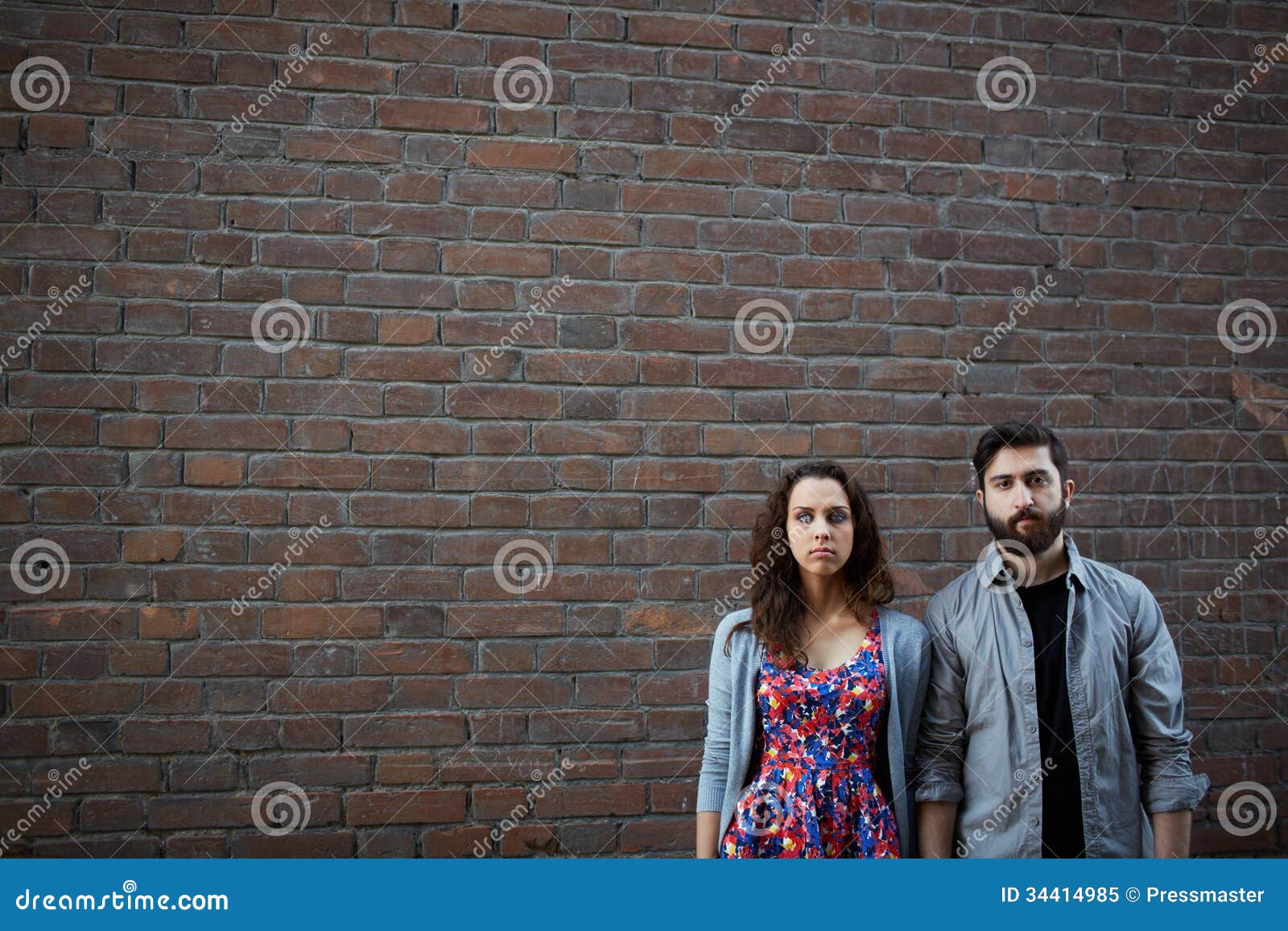 Couple by the brick wall stock image. Image of calm, female - 34414985