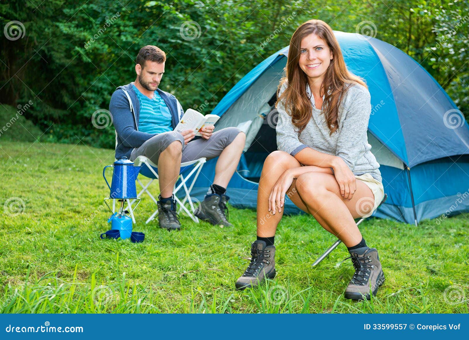 Couple on camping stock image. Image of meadow, field - 33599557