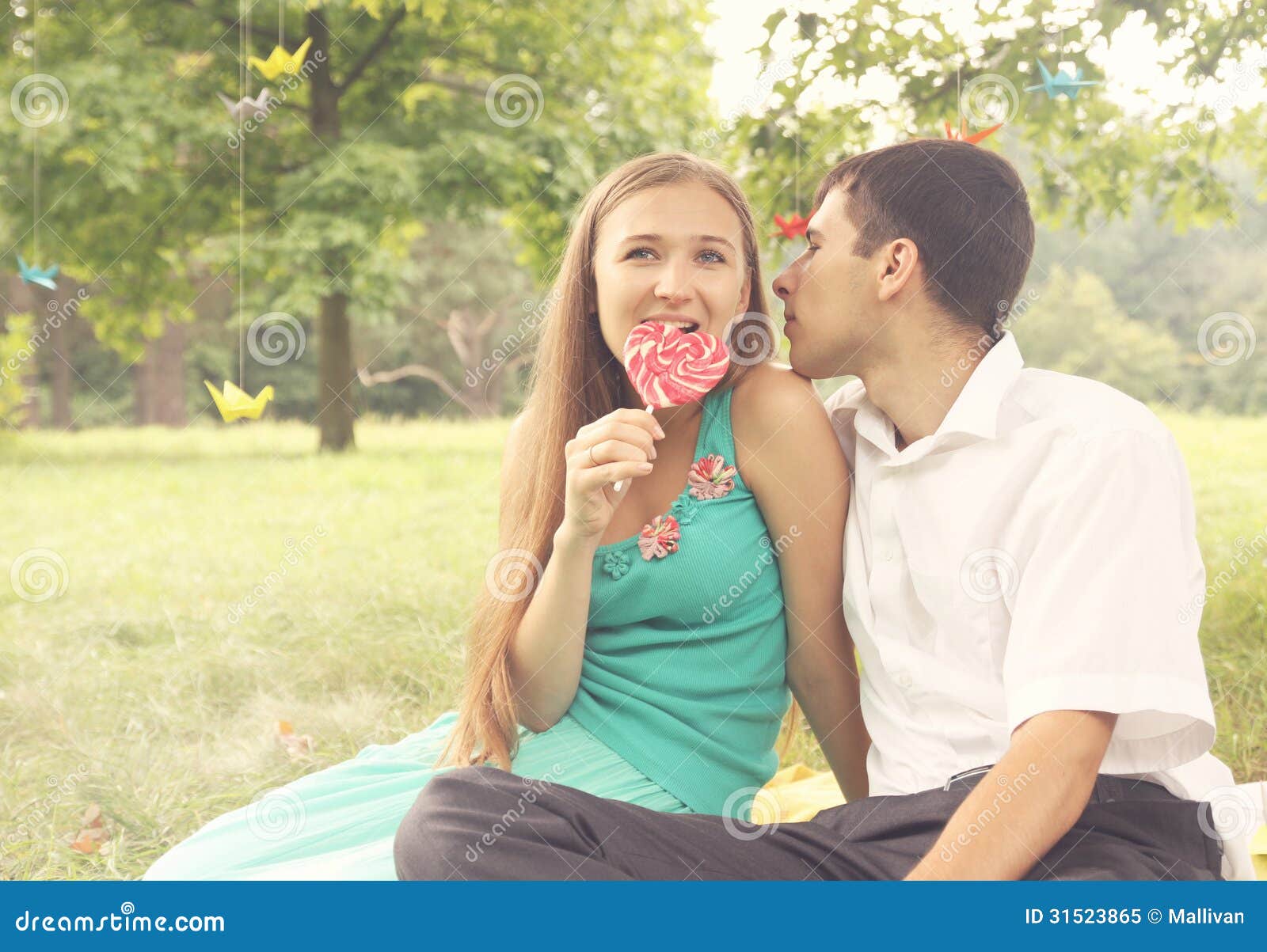 Couple with candy stock image. Image of grass, hobbies - 31523865