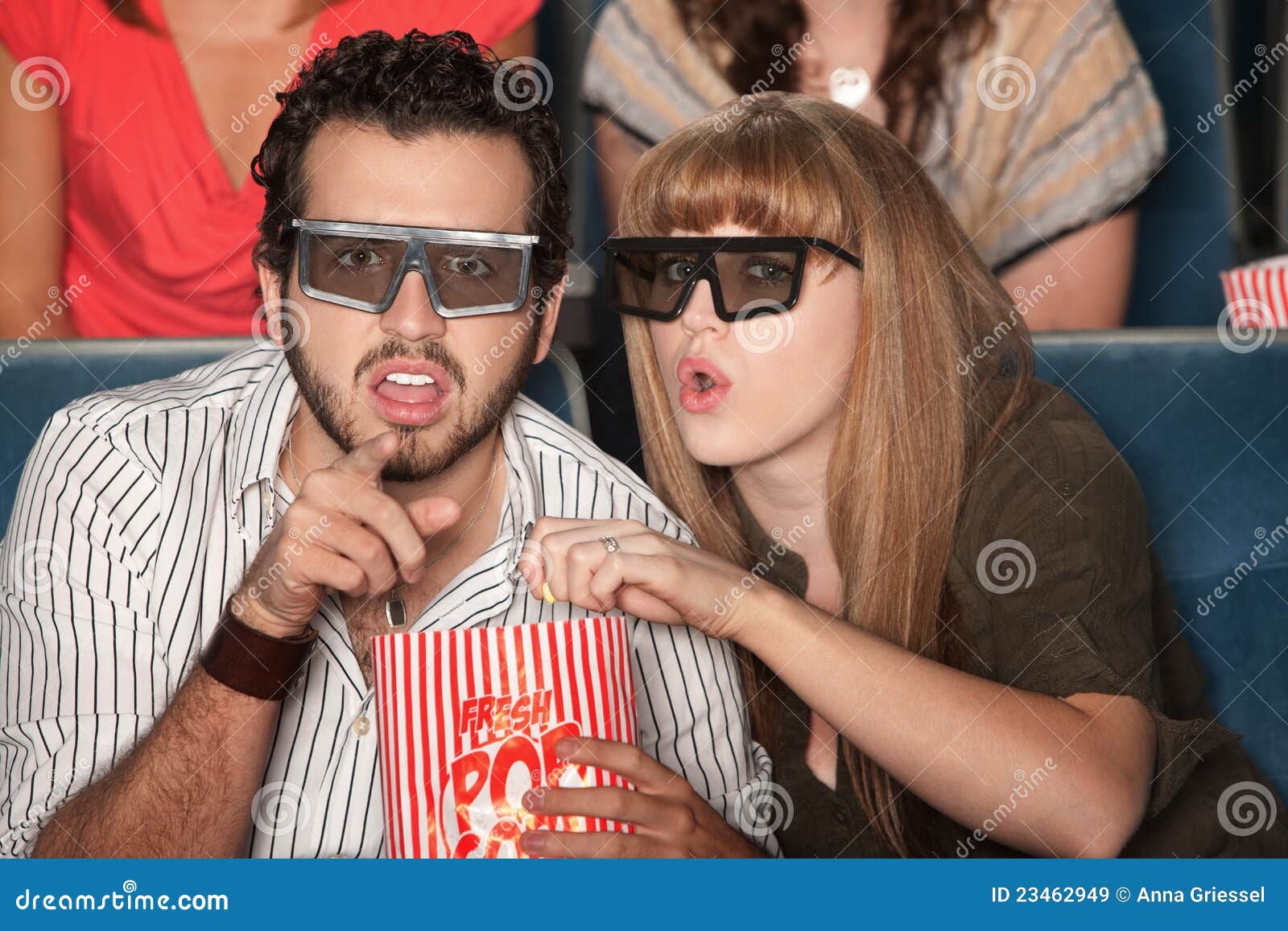 Couple Captivated By 3D Movie Stock Image - Image: 23462949