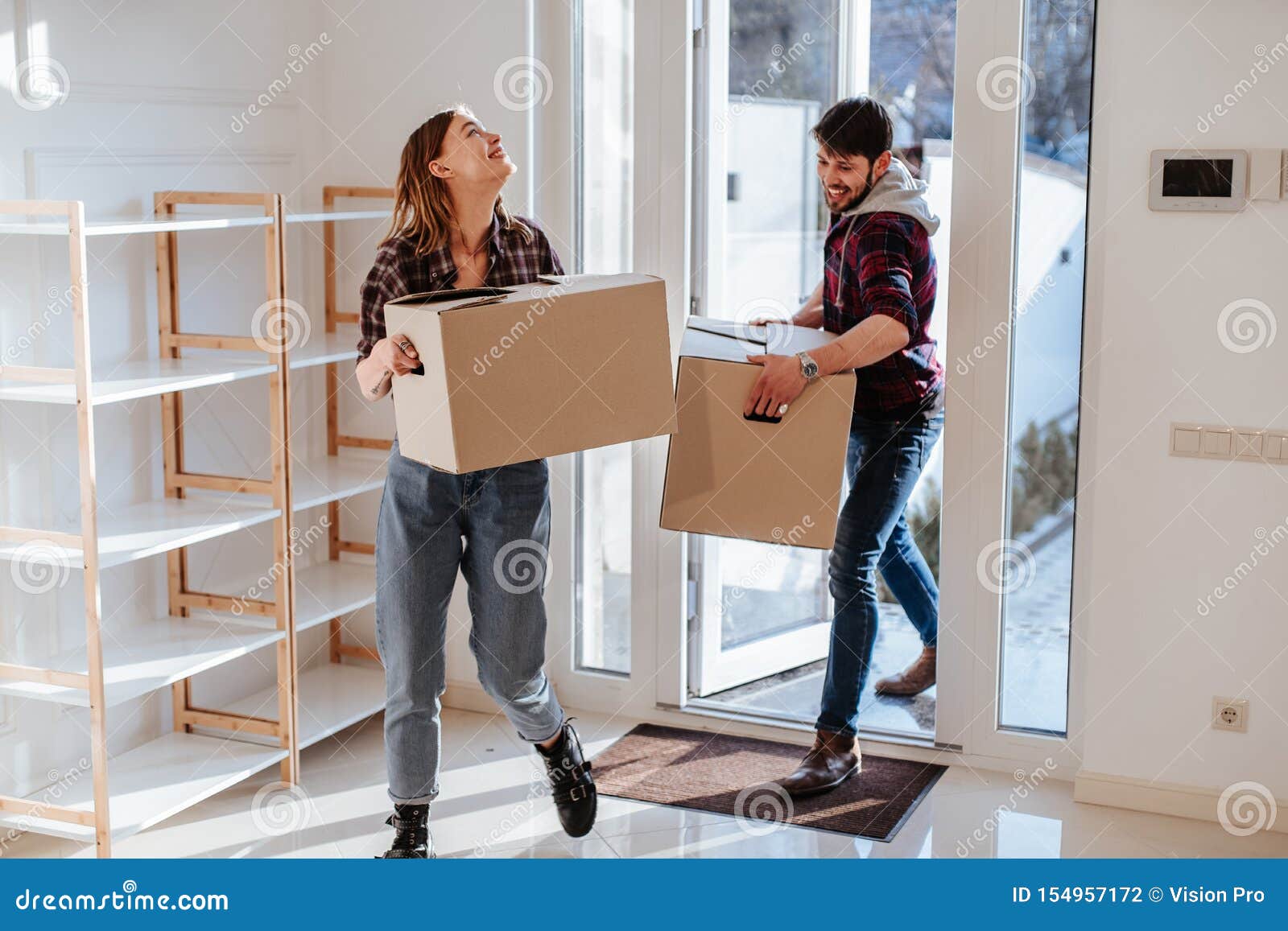 Couple Carrying Boxes into New Home on Moving Day Stock Photo - Image ...