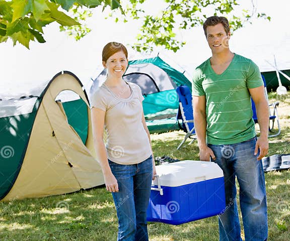 Couple carrying cooler stock image. Image of holding, female - 7329647
