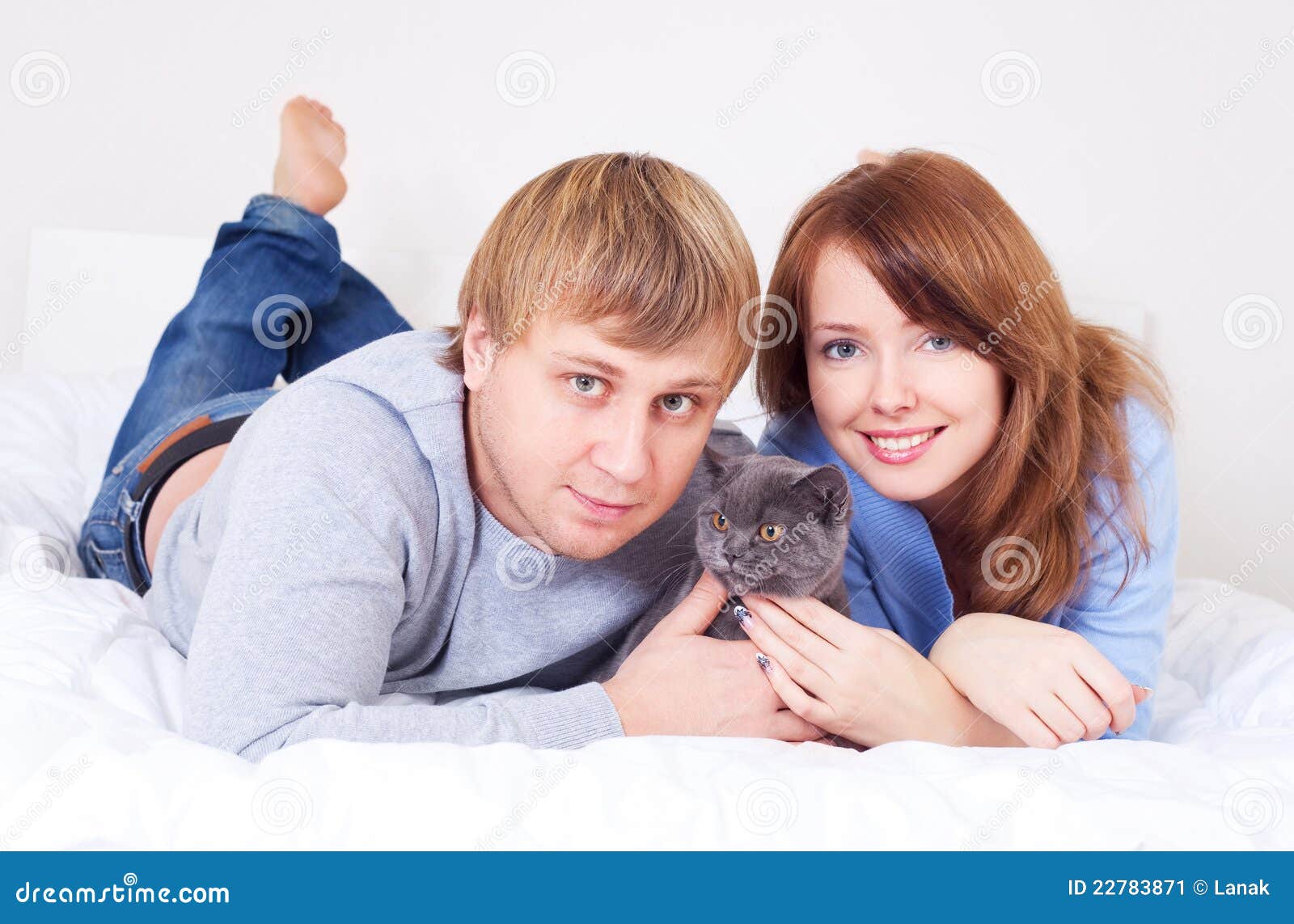 Couple with a cat stock image. Image of house, family - 22783871