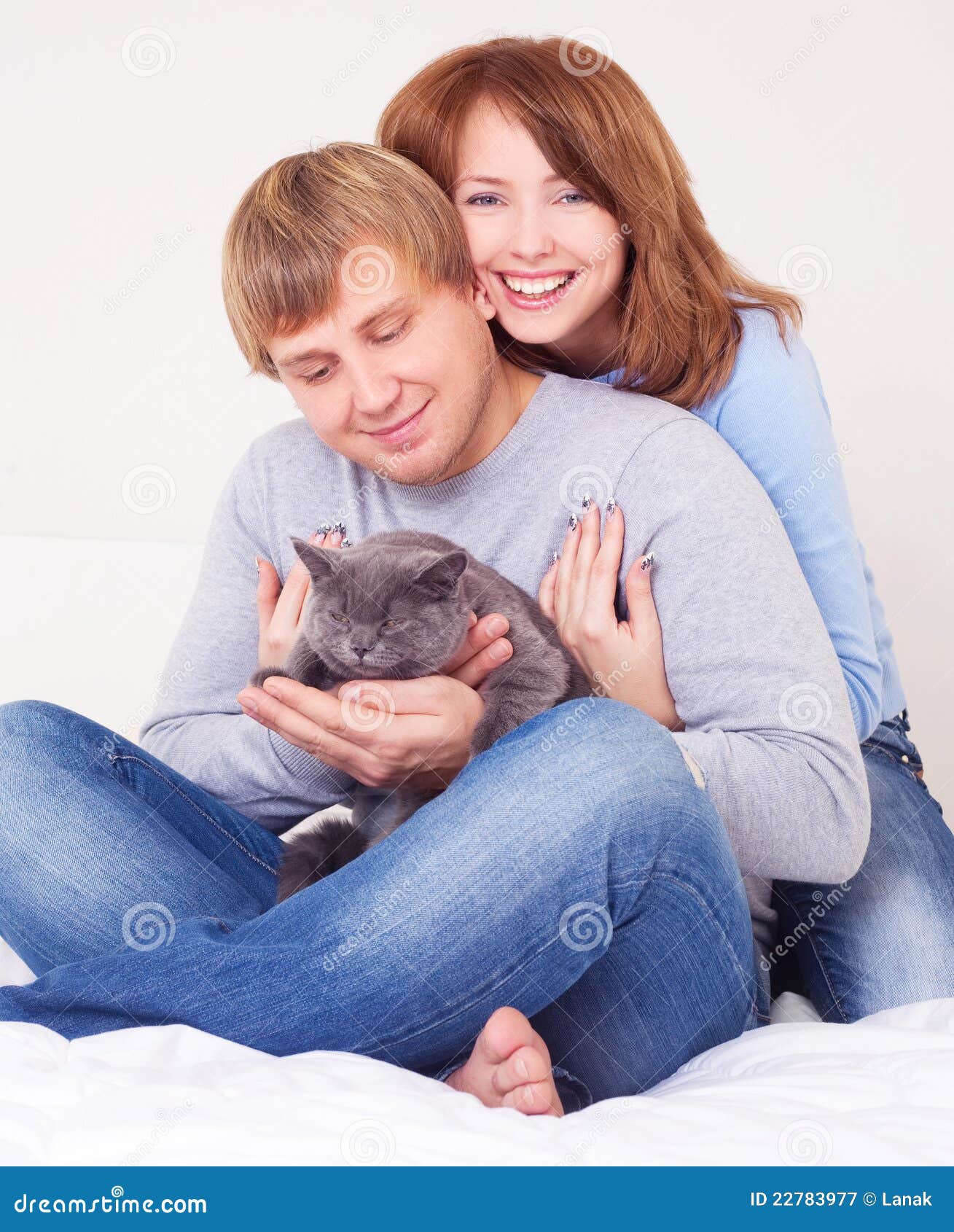 Couple with a cat stock image. Image of affectionate - 22783977