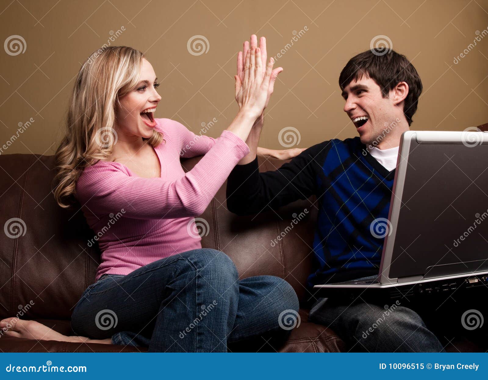 Couple Celebrating with a Computer Stock Image - Image of couple ...