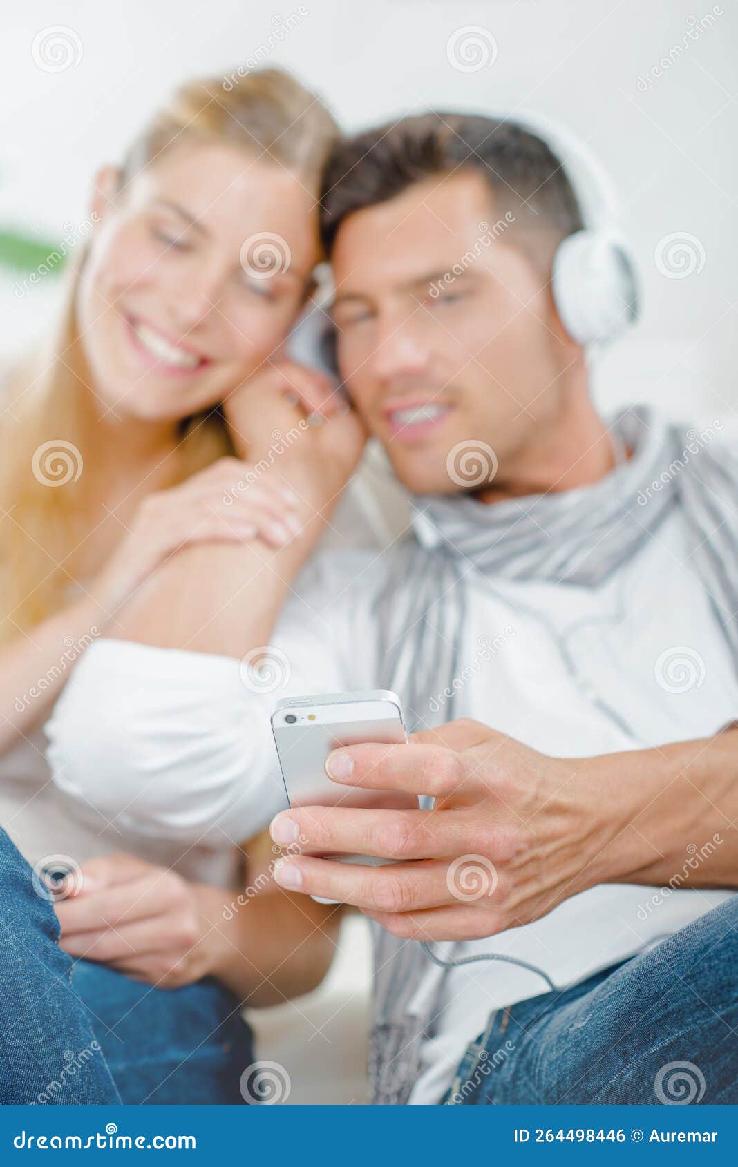 Couple with Cell Phone and Headphones Stock Photo - Image of happy ...
