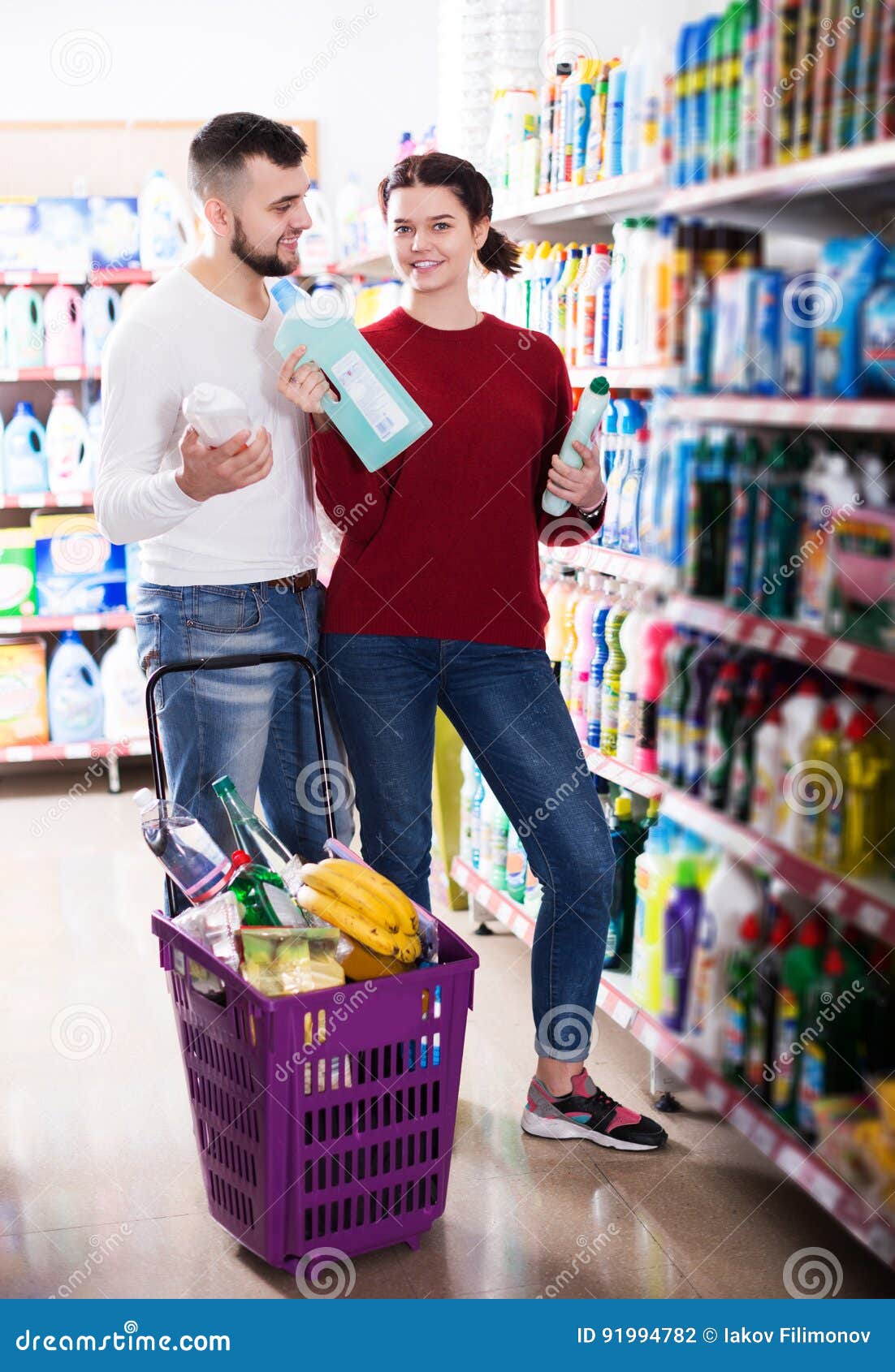 Couple Choose Some Detergents Stock Photo - Image of cleanser, bottle ...