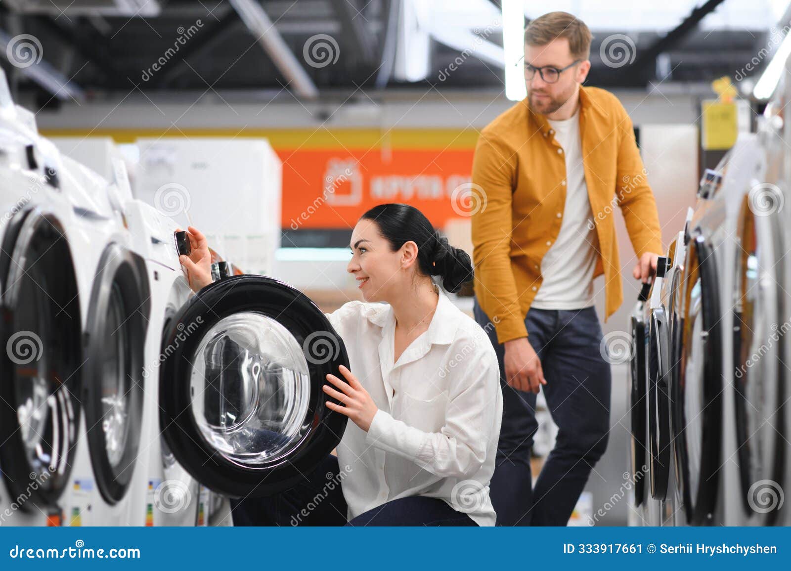 Couple Choosing Wasing Machine at Electronics Store Stock Image - Image ...