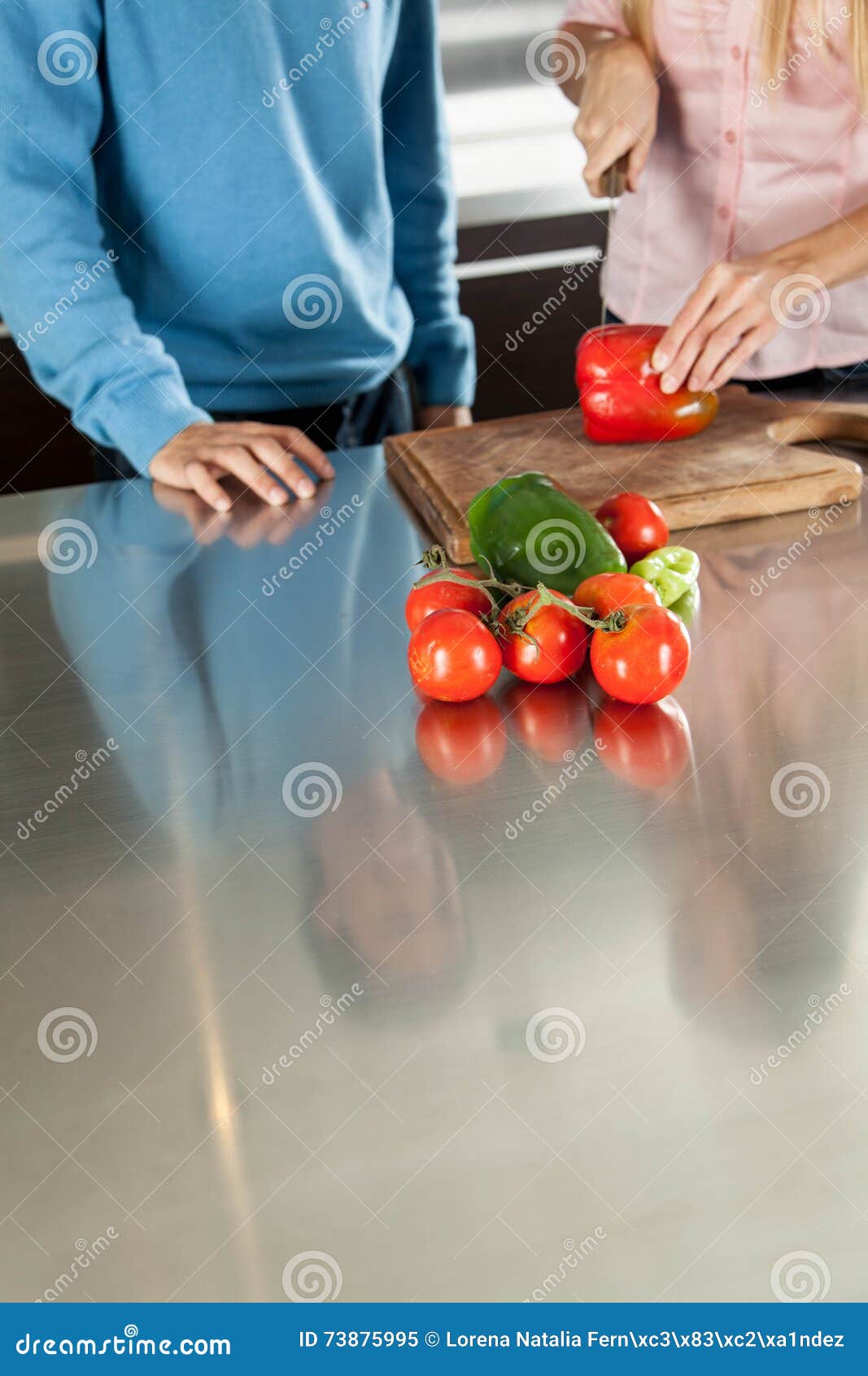 Couple chopping vegetables stock image. Image of dinner - 73875995