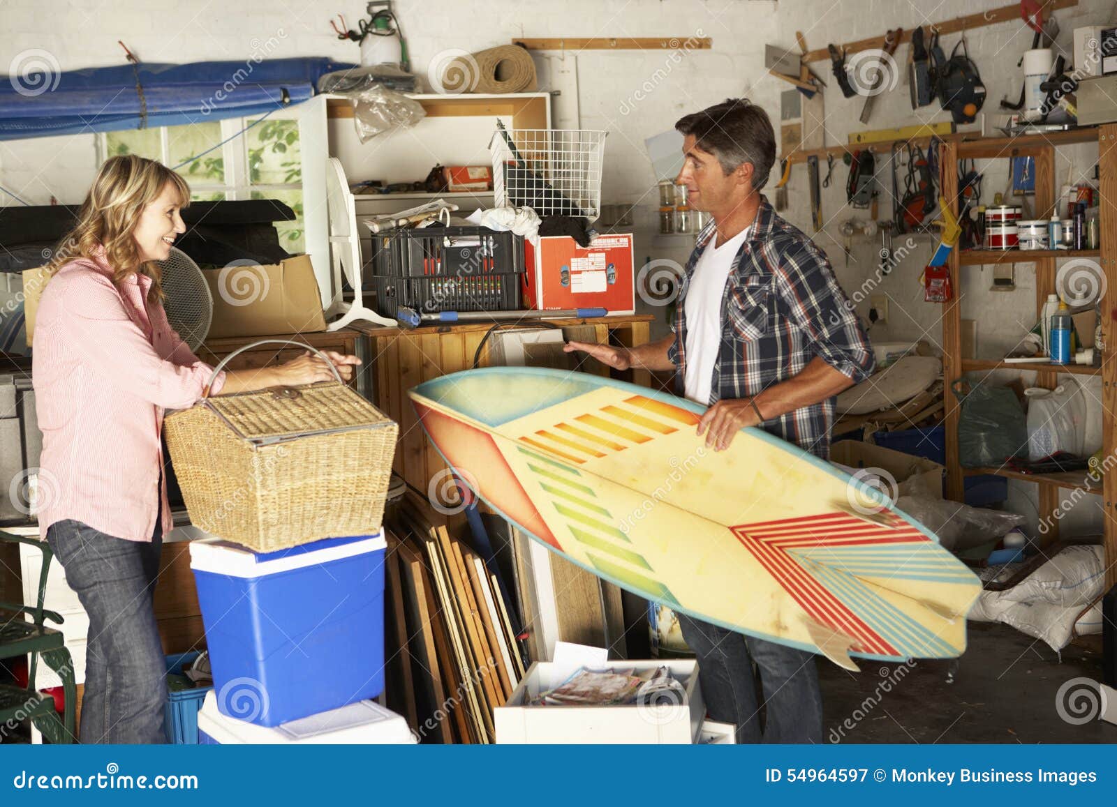 Couple Clearing Garage for Yard Sale Stock Image - Image of garage ...