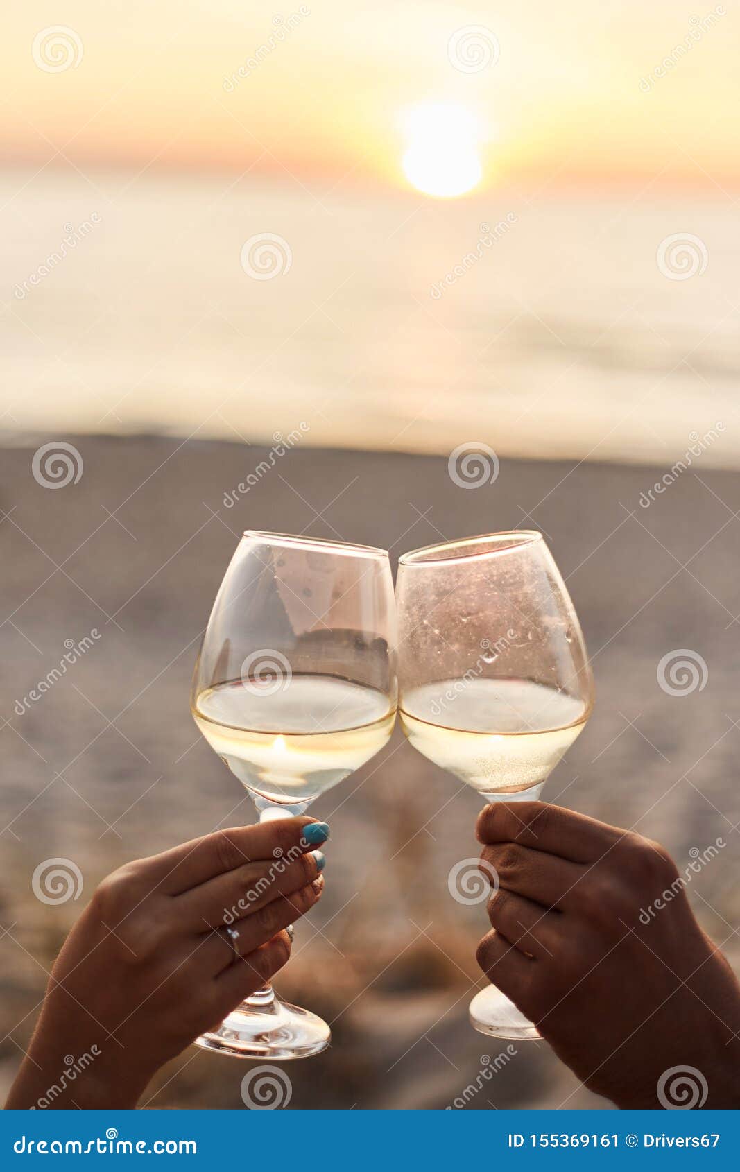 Couple Clinking Glasses of Champagne at Sunset Stock Image - Image of ...