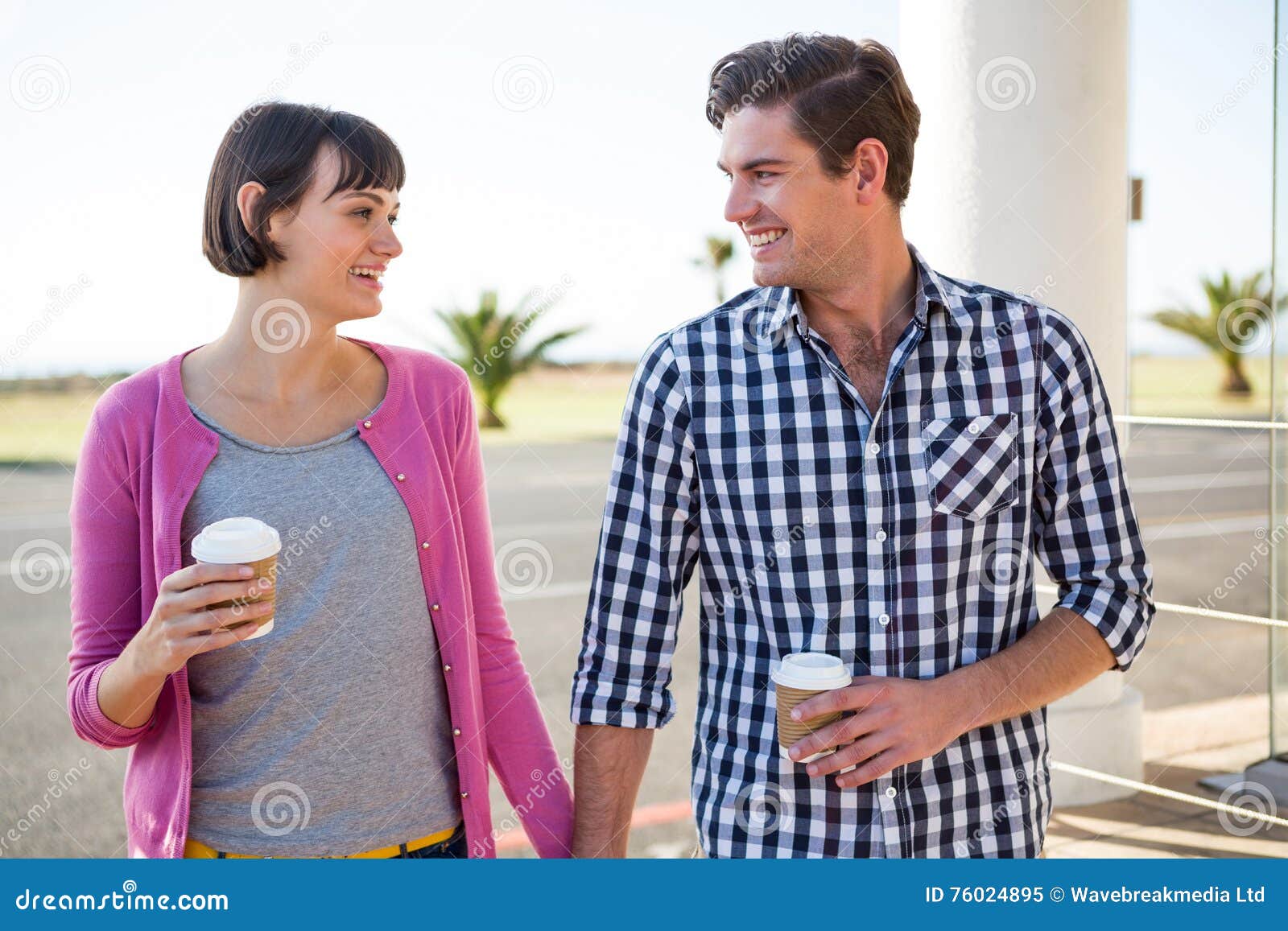 Couple with Coffee Cups Walking Together Stock Image - Image of lover ...