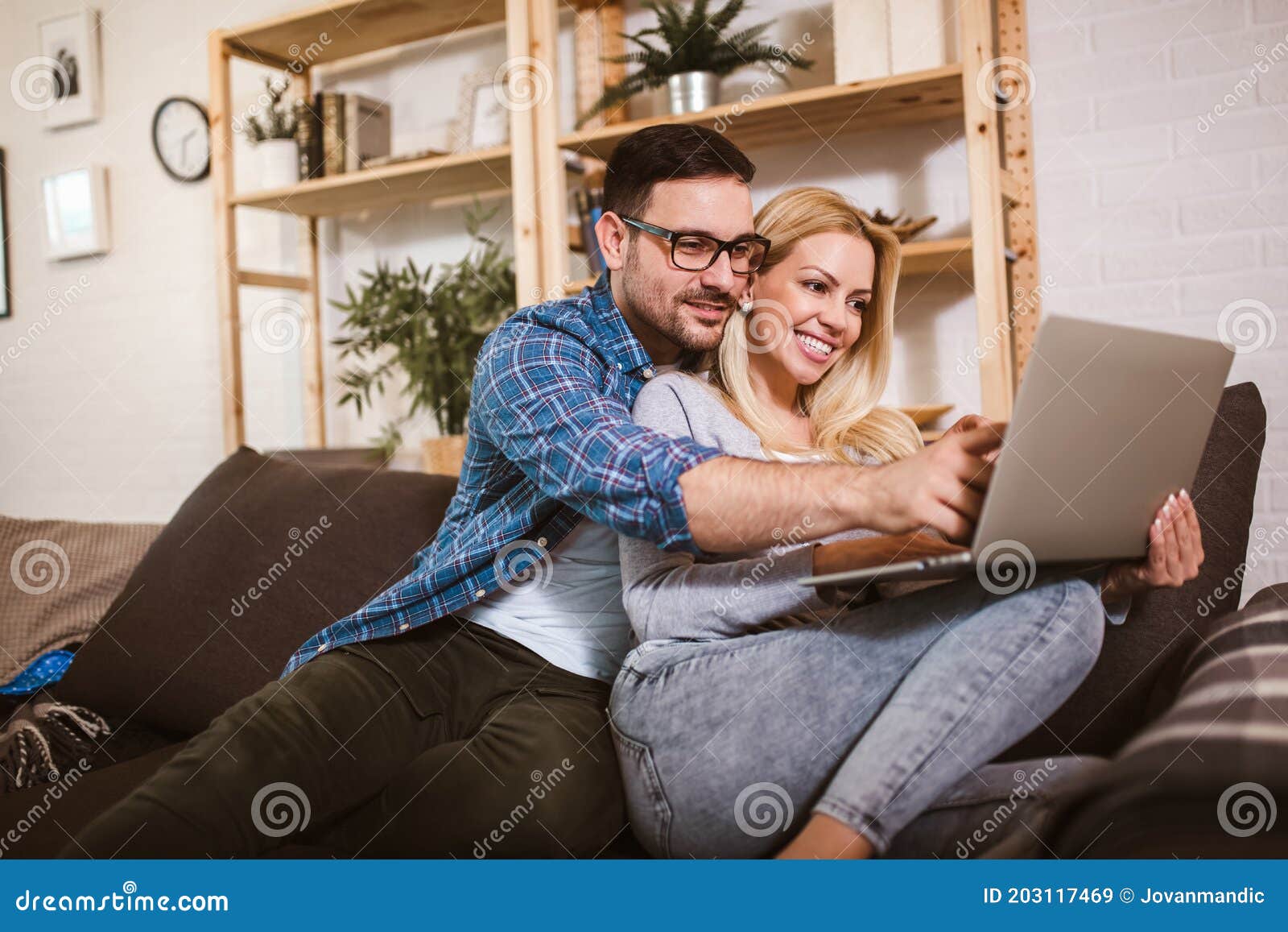 Couple Communicating while Using Laptop at Home Stock Image - Image of ...