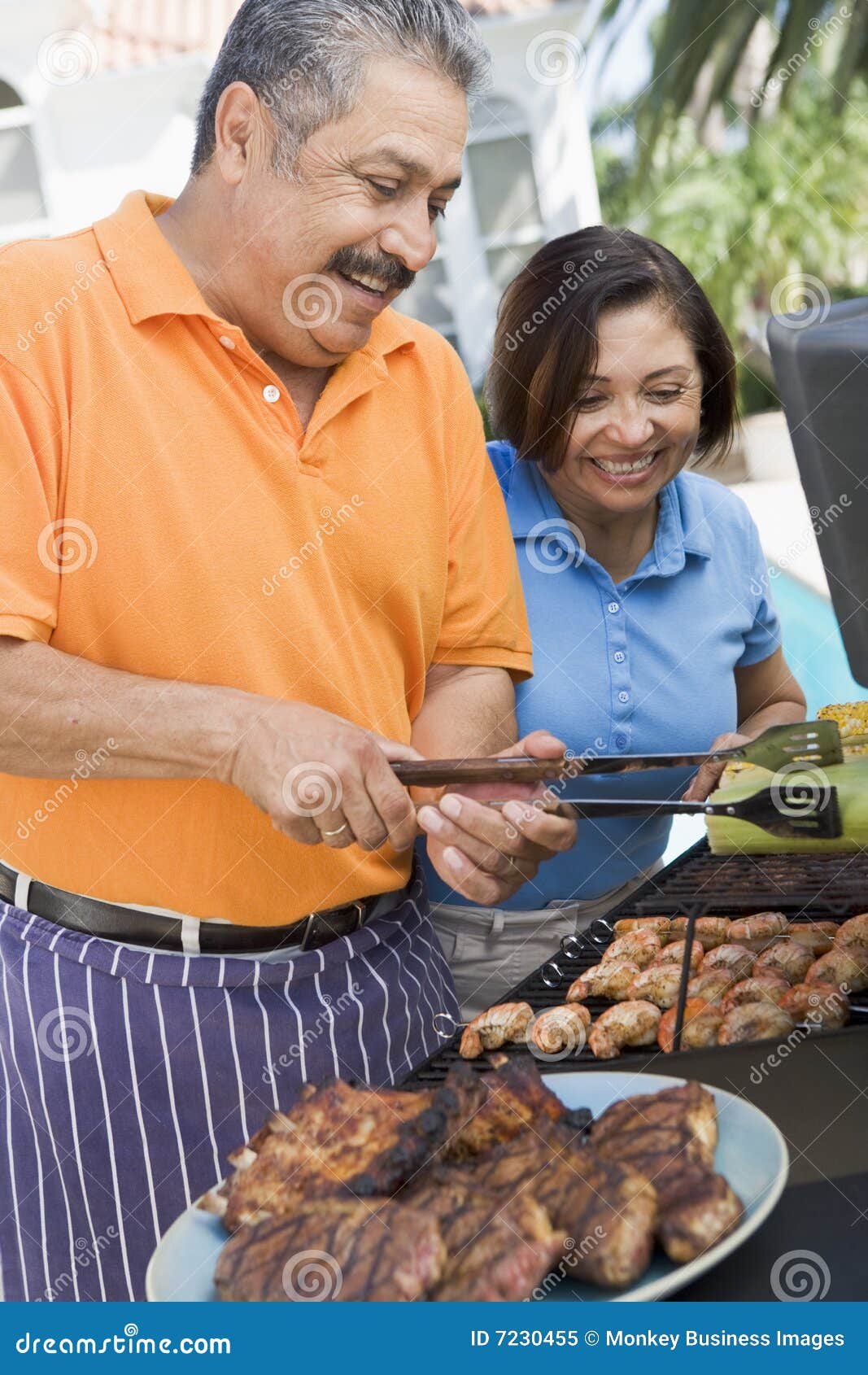 Couple Cooking on a Barbeque Stock Image - Image of hispanic, happy ...