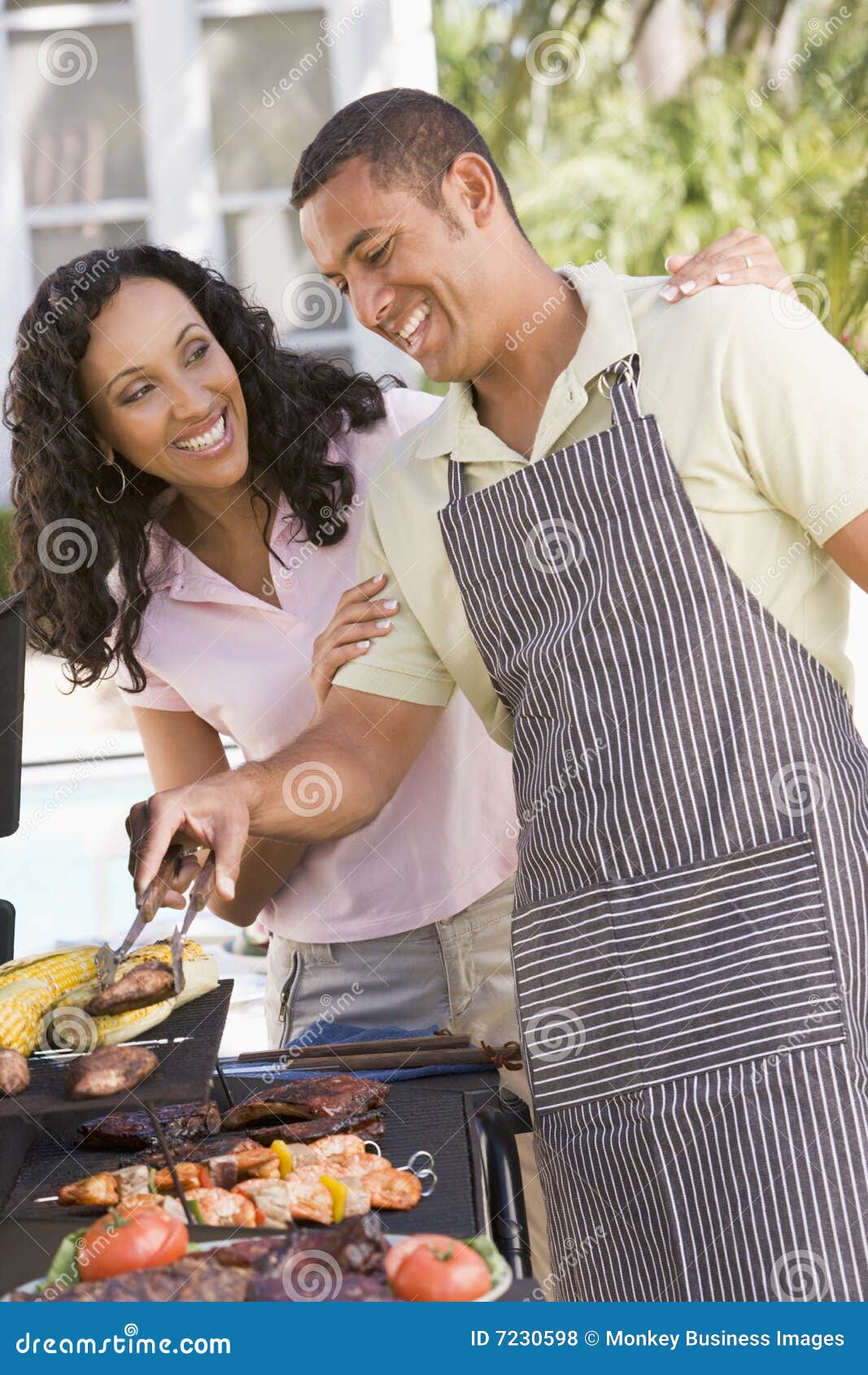 Couple Cooking on a Barbeque Stock Photo - Image of happy, colour: 7230598