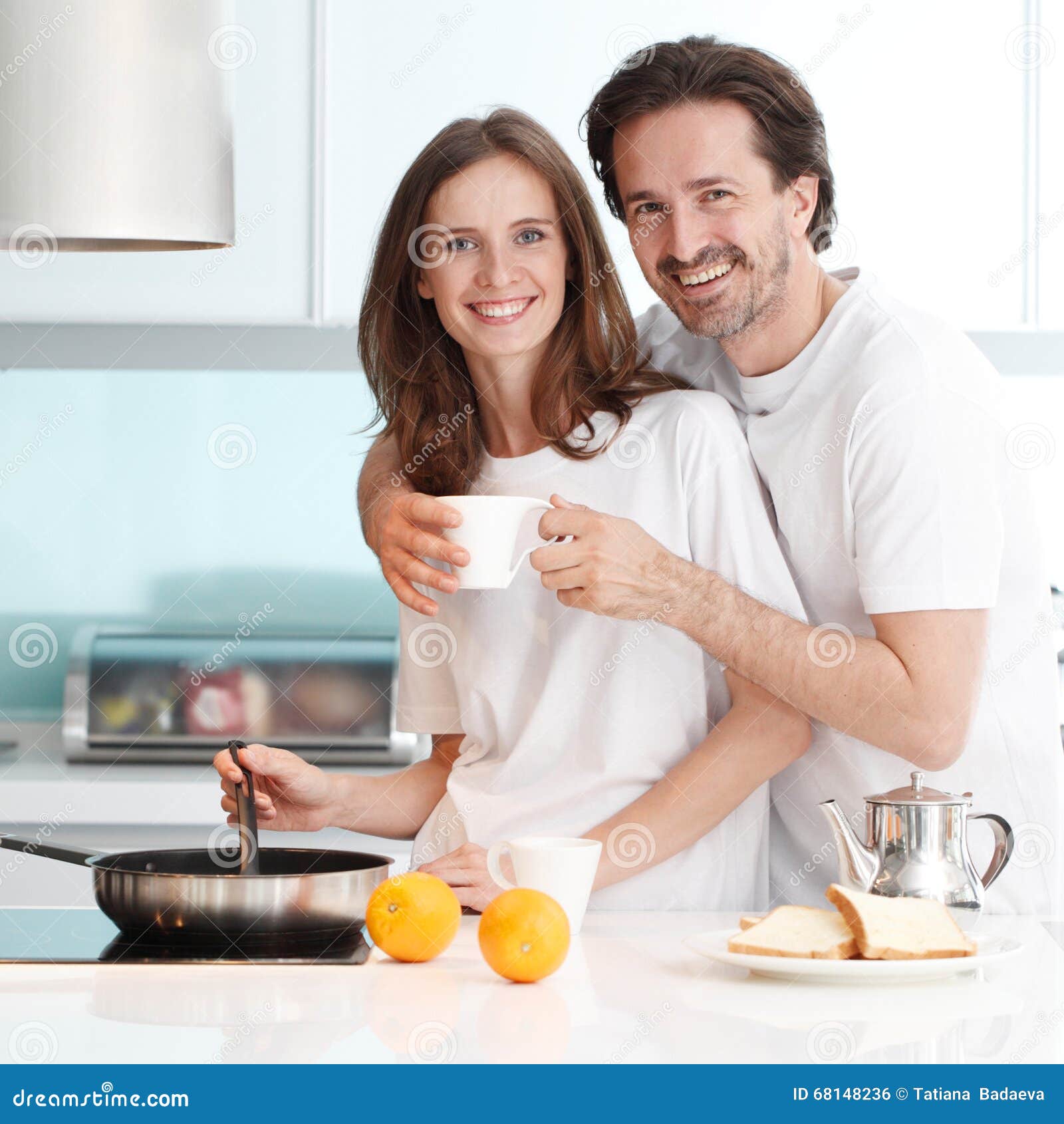 Couple cooking breakfast stock photo. Image of healthy - 68148236