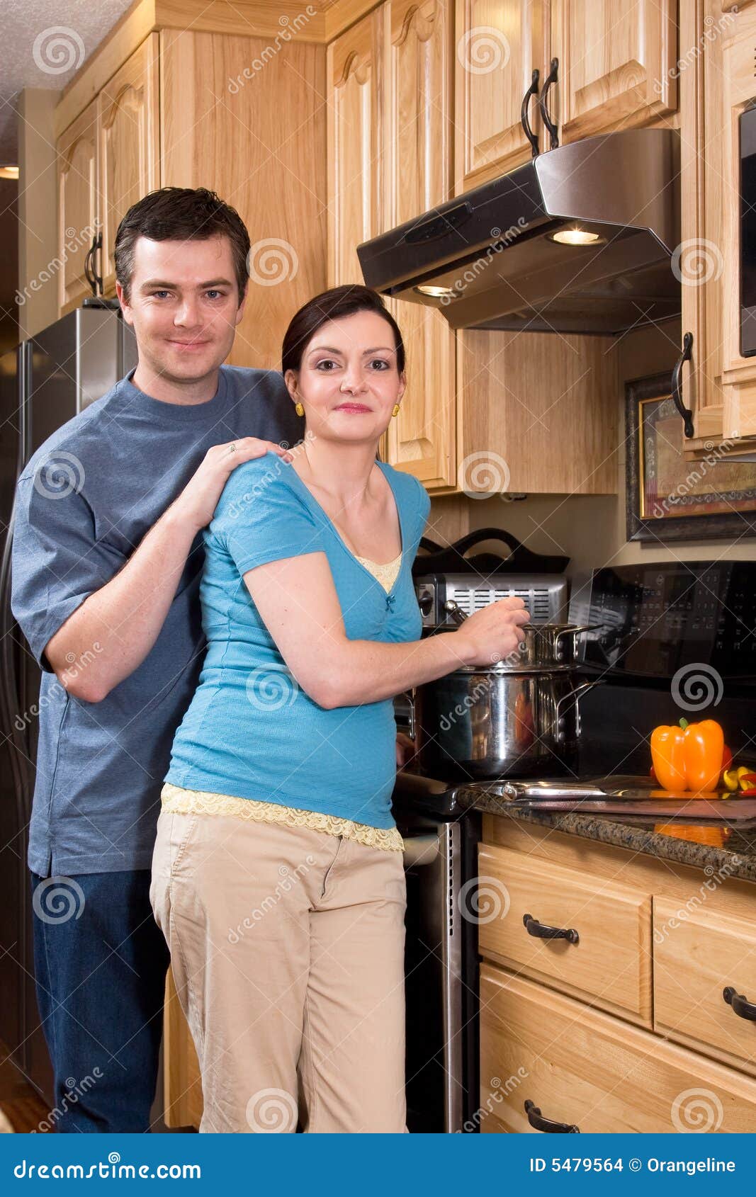 A Couple Cooking in the Kitchen - Vertical Stock Photo - Image of ...