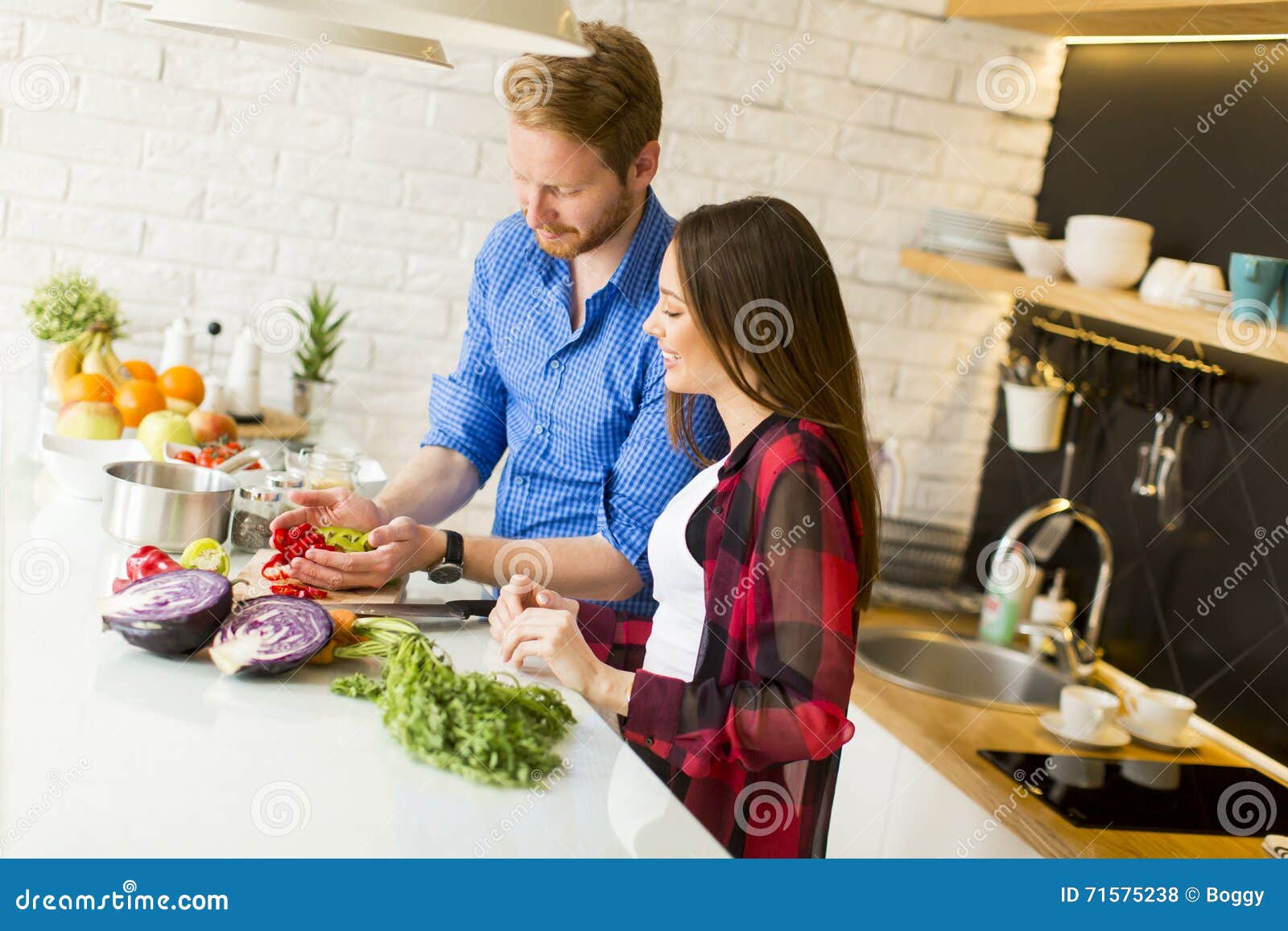 Couple cooking together stock photo. Image of kitchen - 71575238
