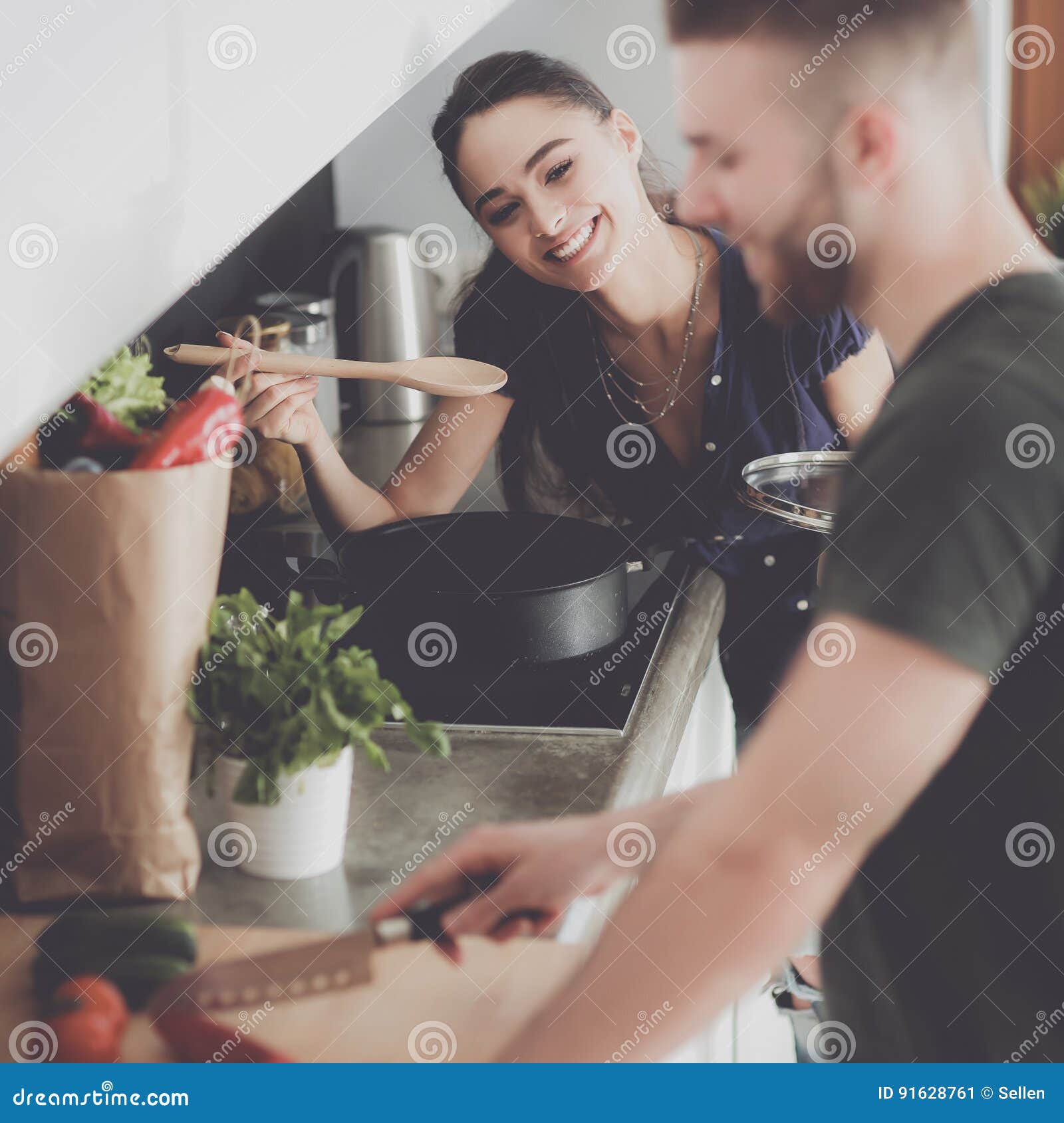 Couple Cooking Together in Their Kitchen at Home Stock Image - Image of ...
