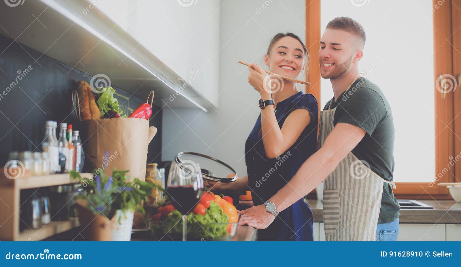 Couple Cooking Together in Their Kitchen at Home Stock Photo - Image of ...