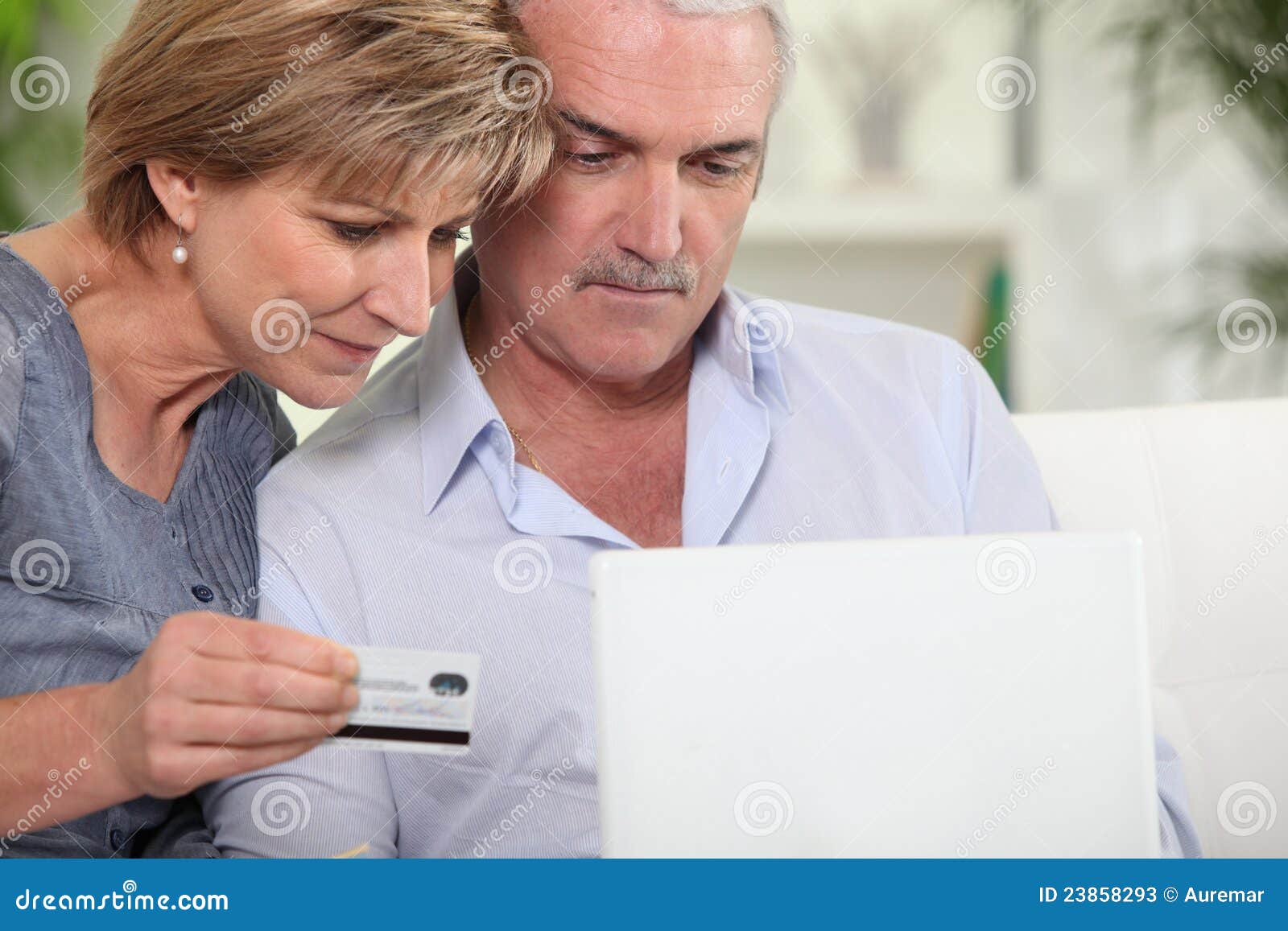 Couple with credit card stock image. Image of attentive - 23858293