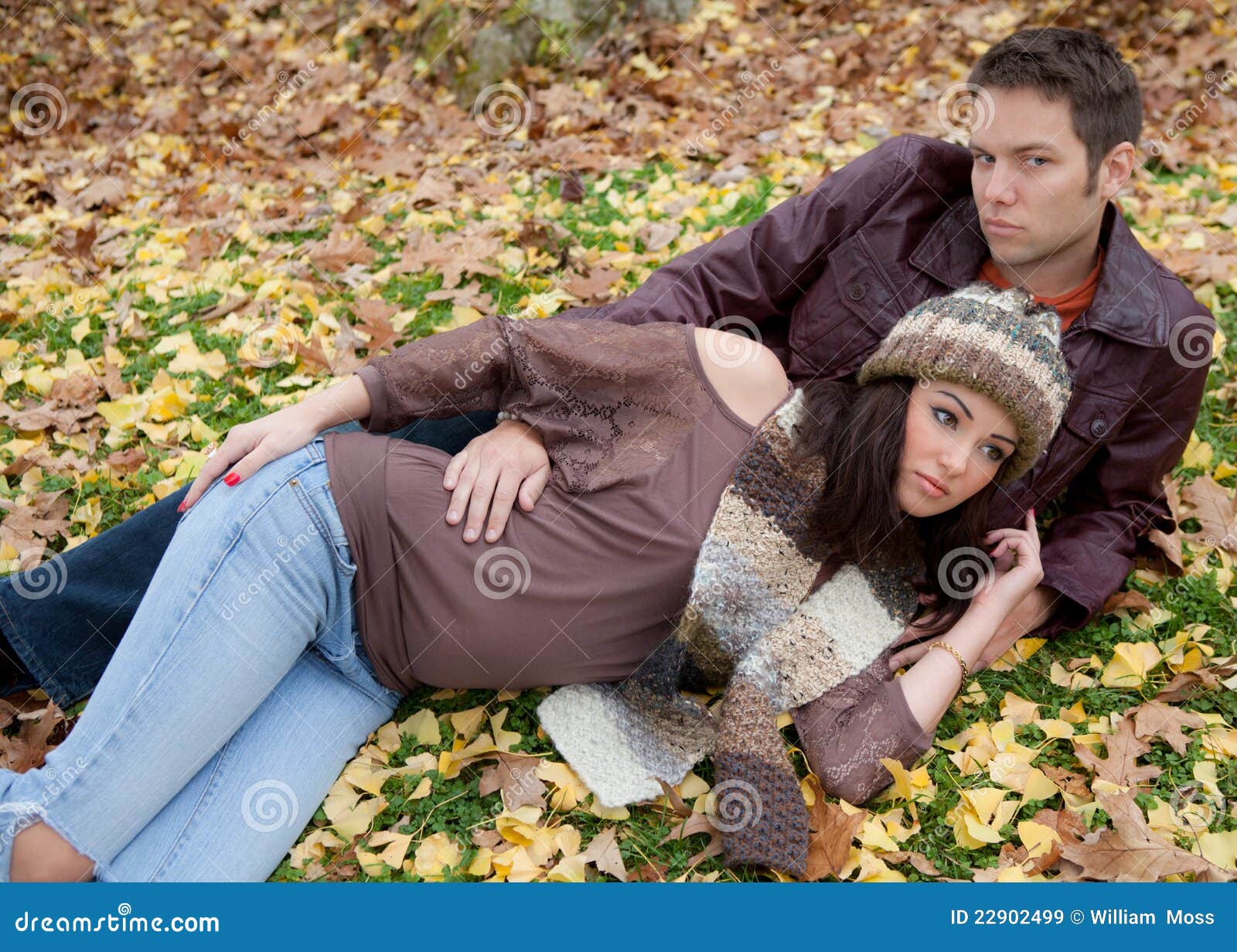 Couple Cuddling in Grass stock image. Image of model - 22902499