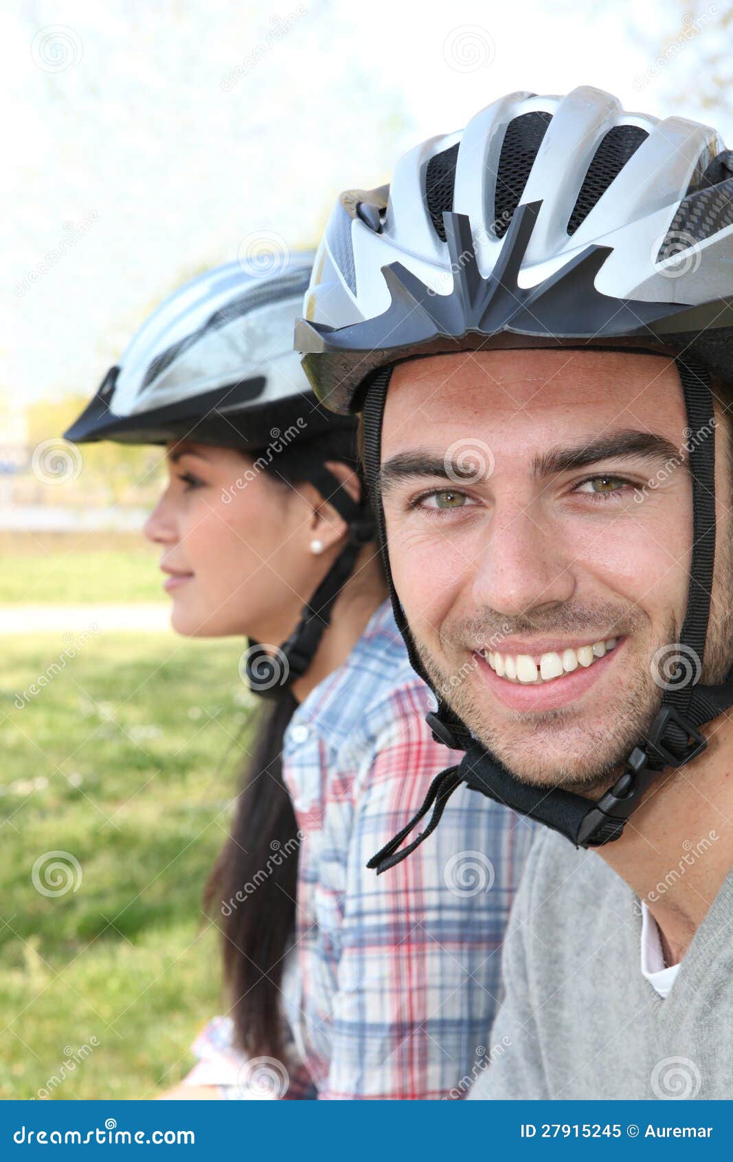 Couple of Cyclists Wearing Helmets Stock Image - Image of break, grass ...