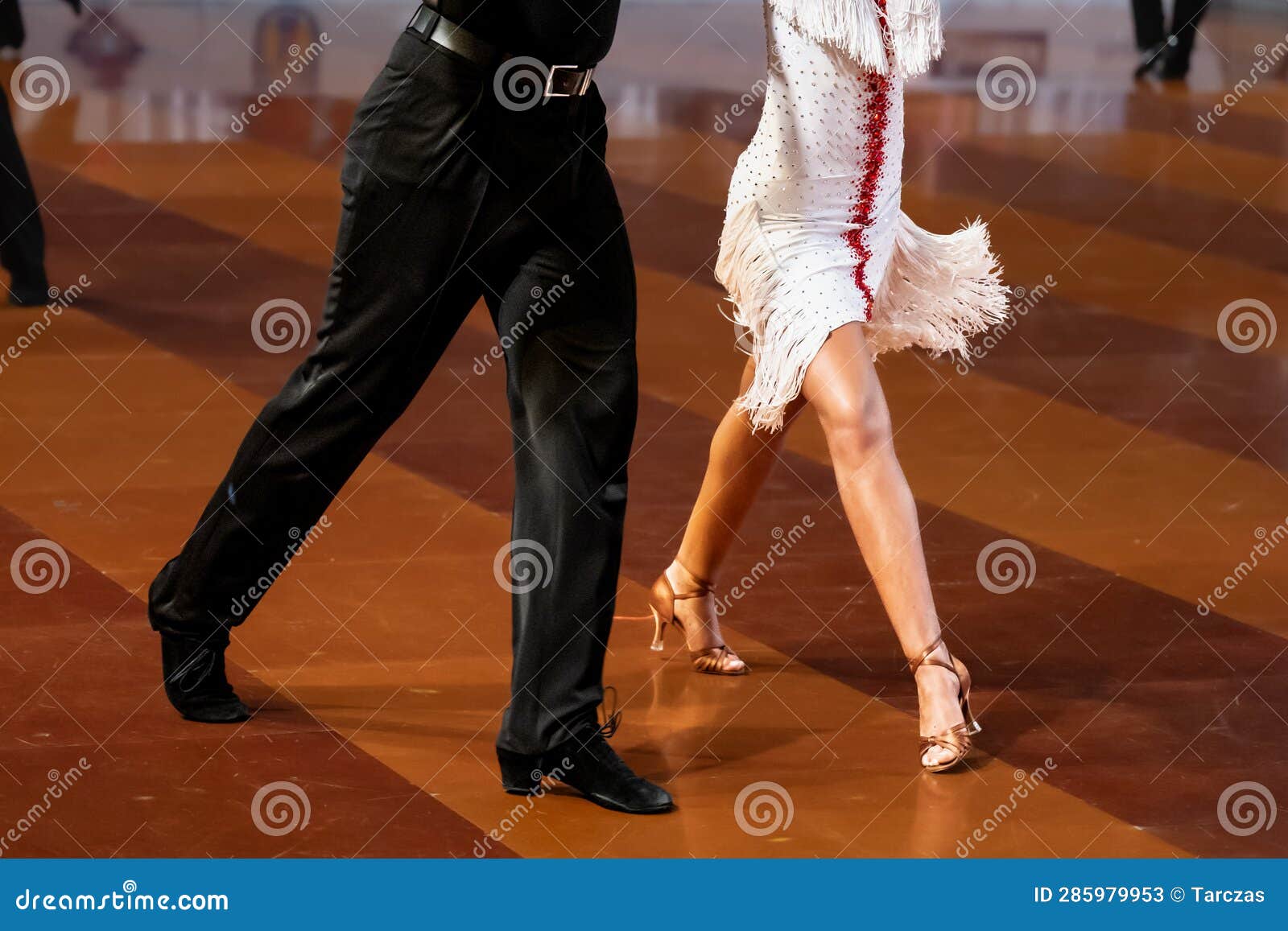 A Couple Dance a Latin Dance. the Legs of a Dancing Couple Stock Image ...