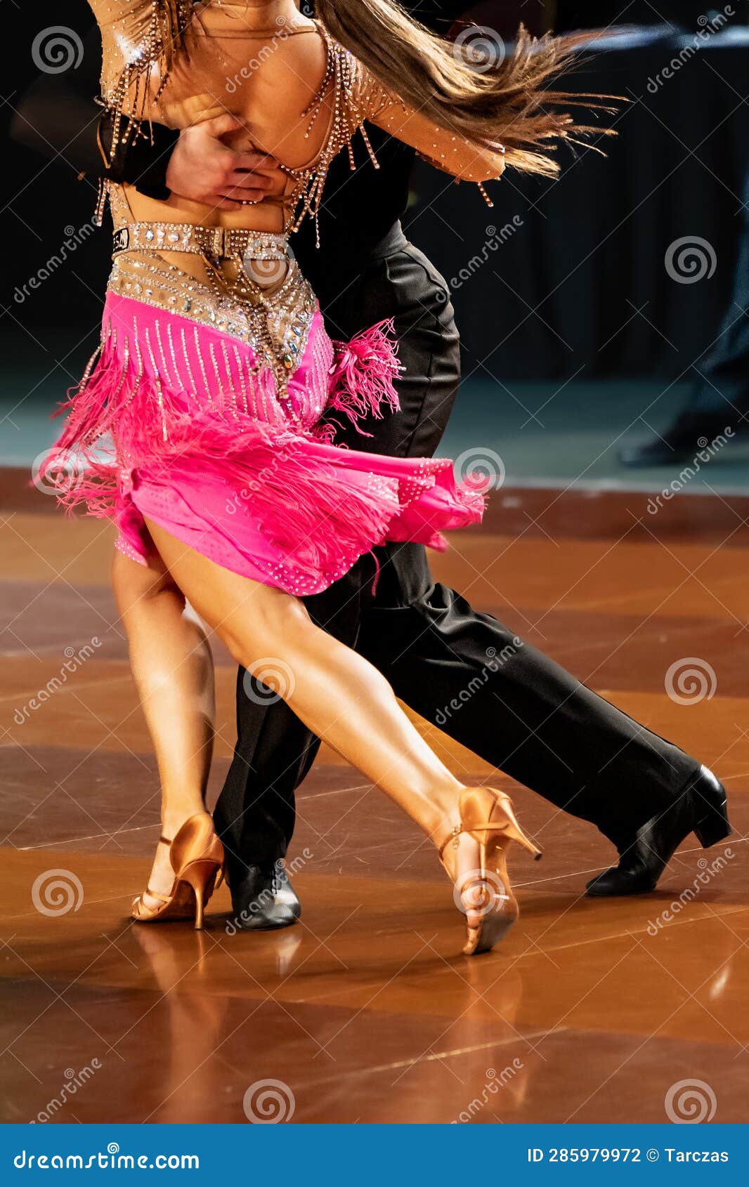 A Couple Dance a Latin Dance. the Legs of a Dancing Couple Stock Photo ...