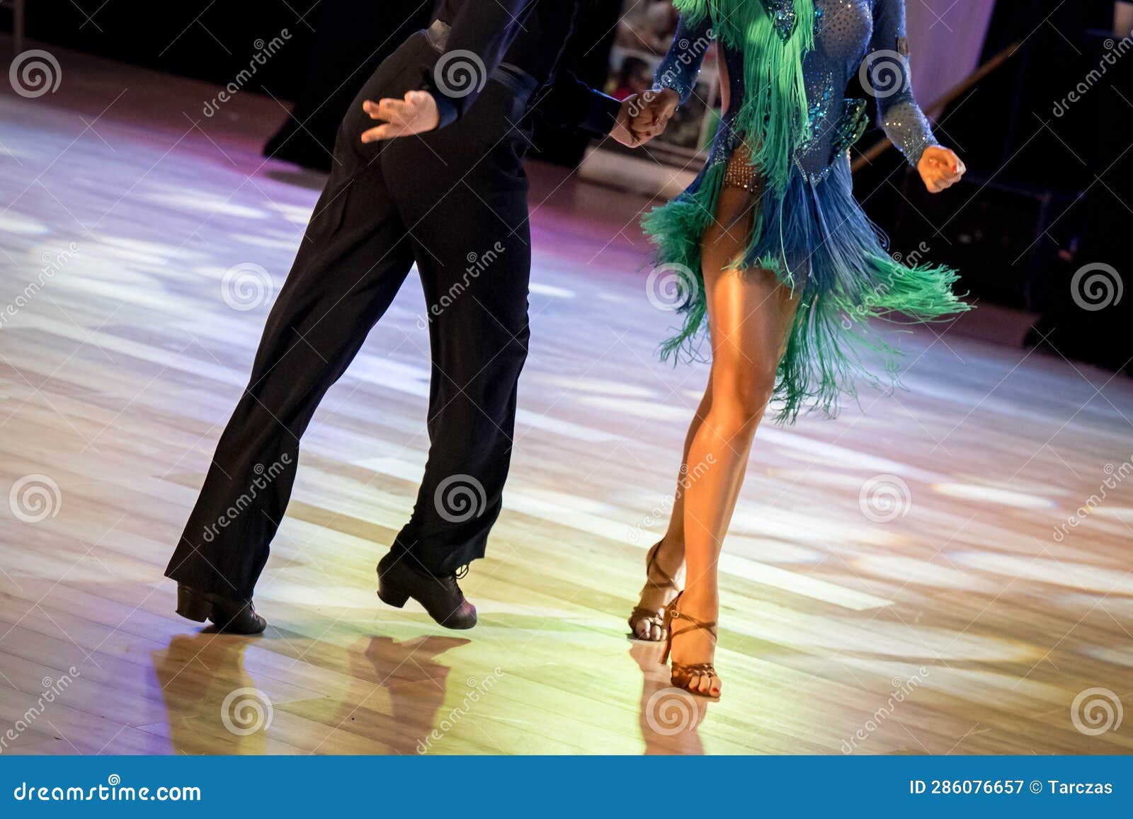 A Couple Dance a Latin Dance. the Legs of a Dancing Couple Stock Image ...
