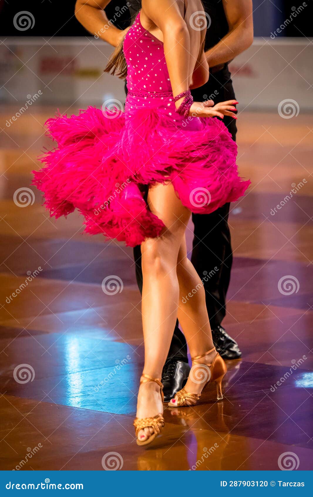 A Couple Dance a Latin Dance. the Legs of a Dancing Couple Stock Photo ...