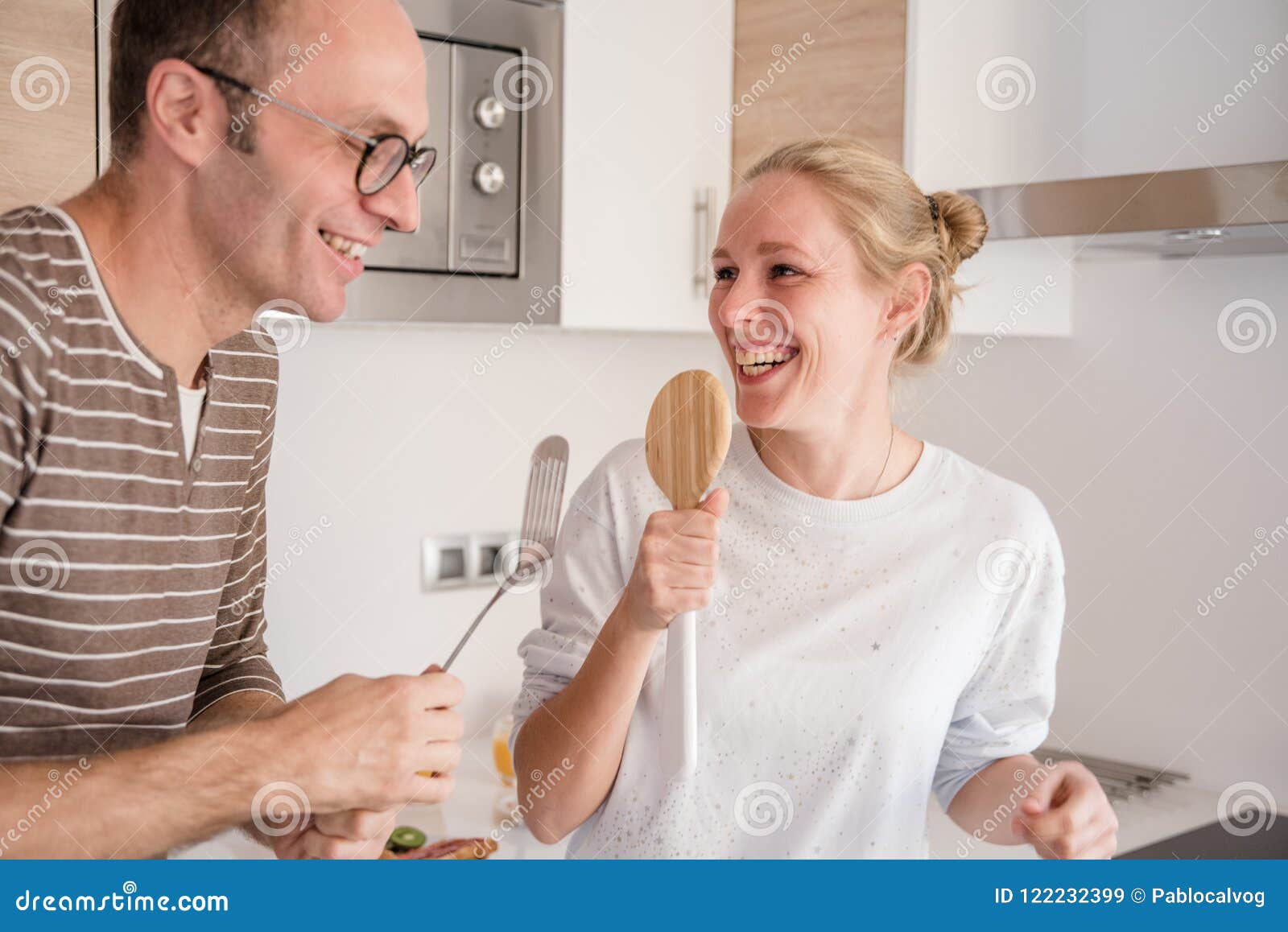 Couple Singing and Laughing in the Kitchen Stock Image - Image of ...