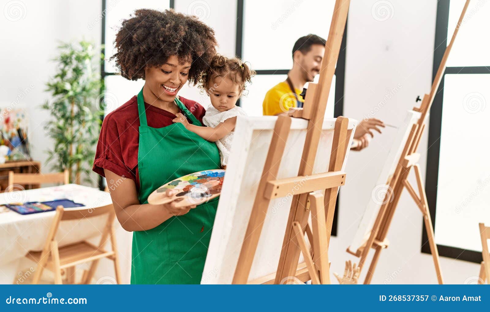 Couple and Daughter Smiling Confident Drawing at Art Studio Stock Image ...