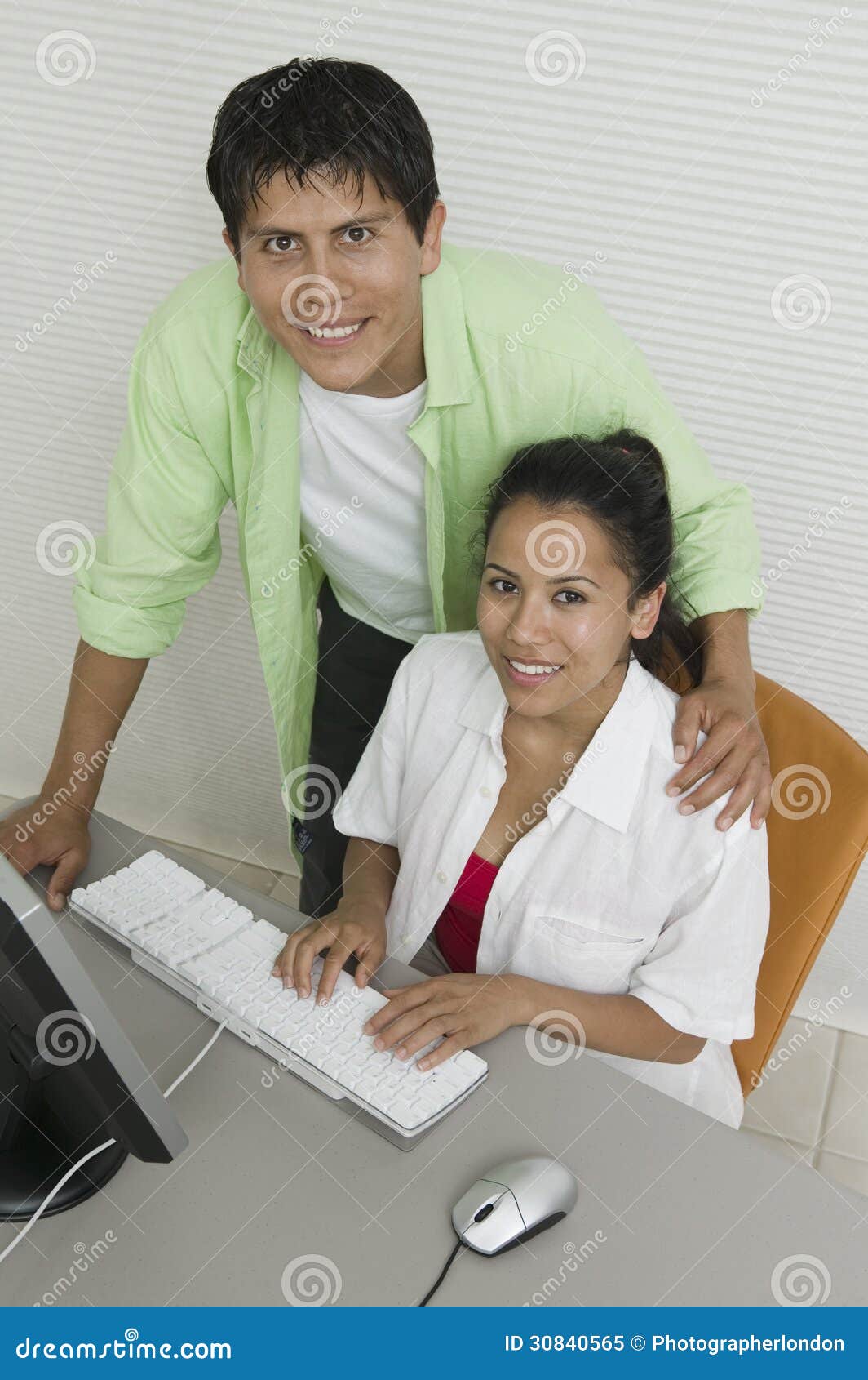 Couple at Desk Using Computer Portrait High Angle View Stock Image ...
